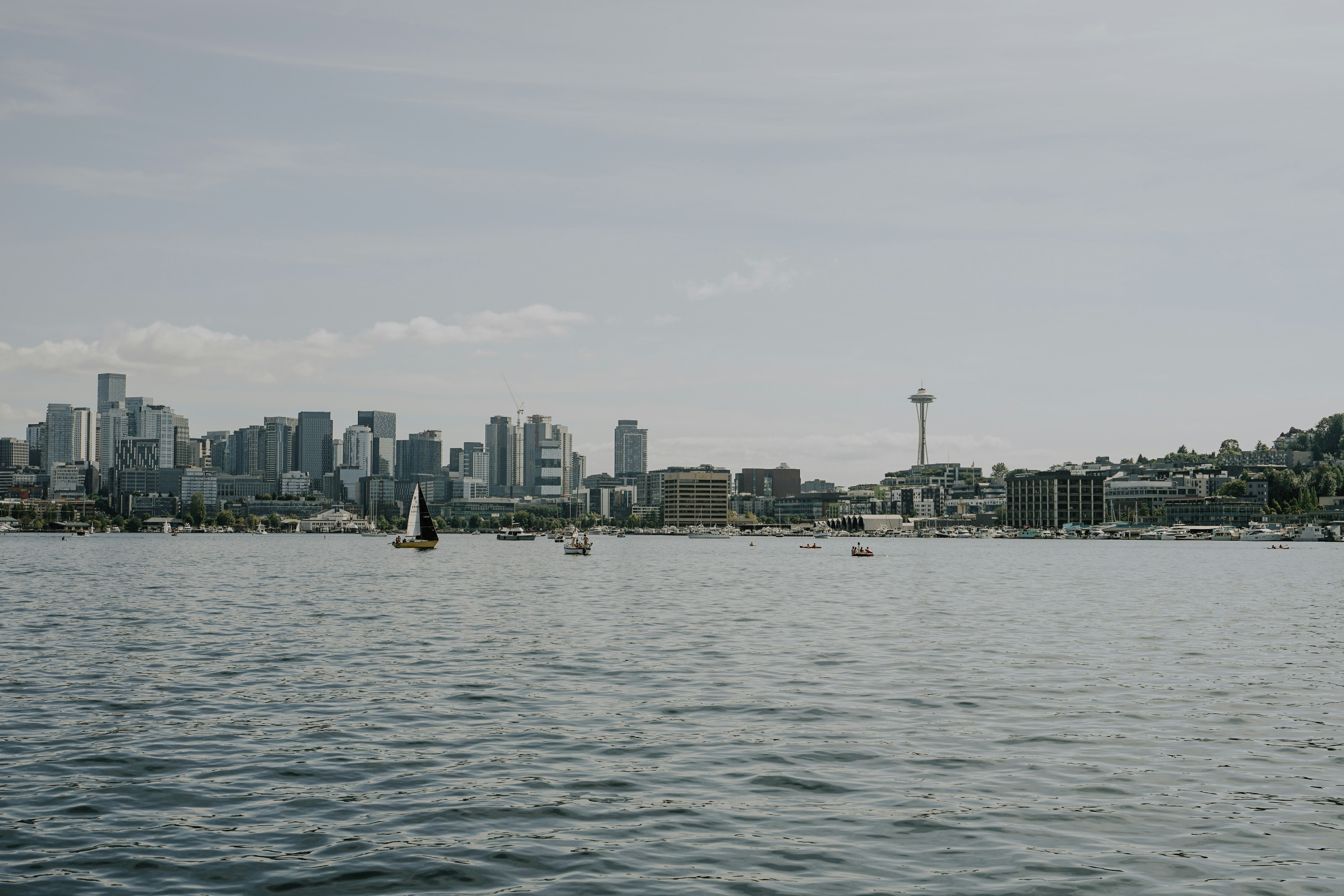 City skyline across the water on a cloudy day.