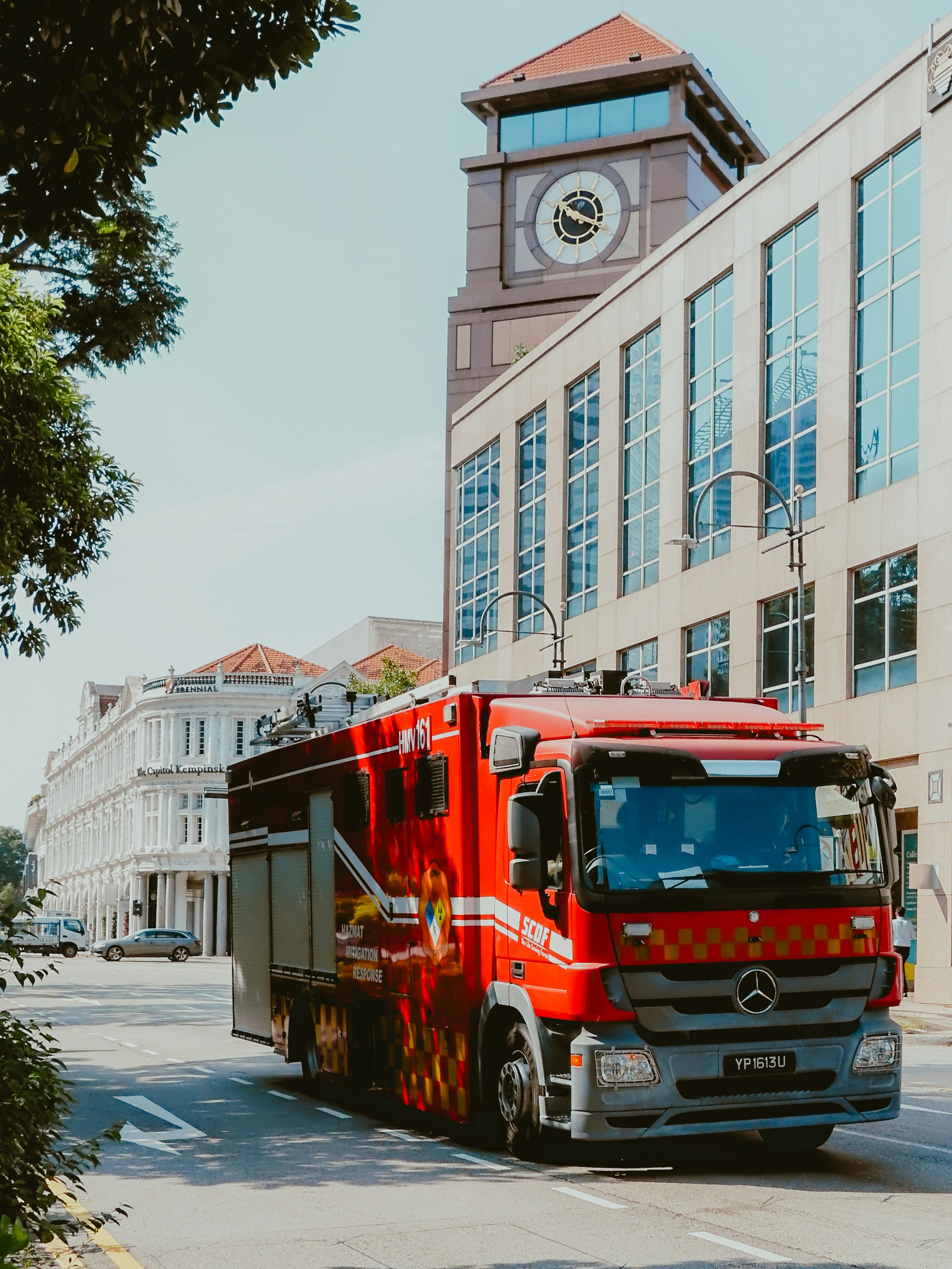 Red fire truck driving on a street