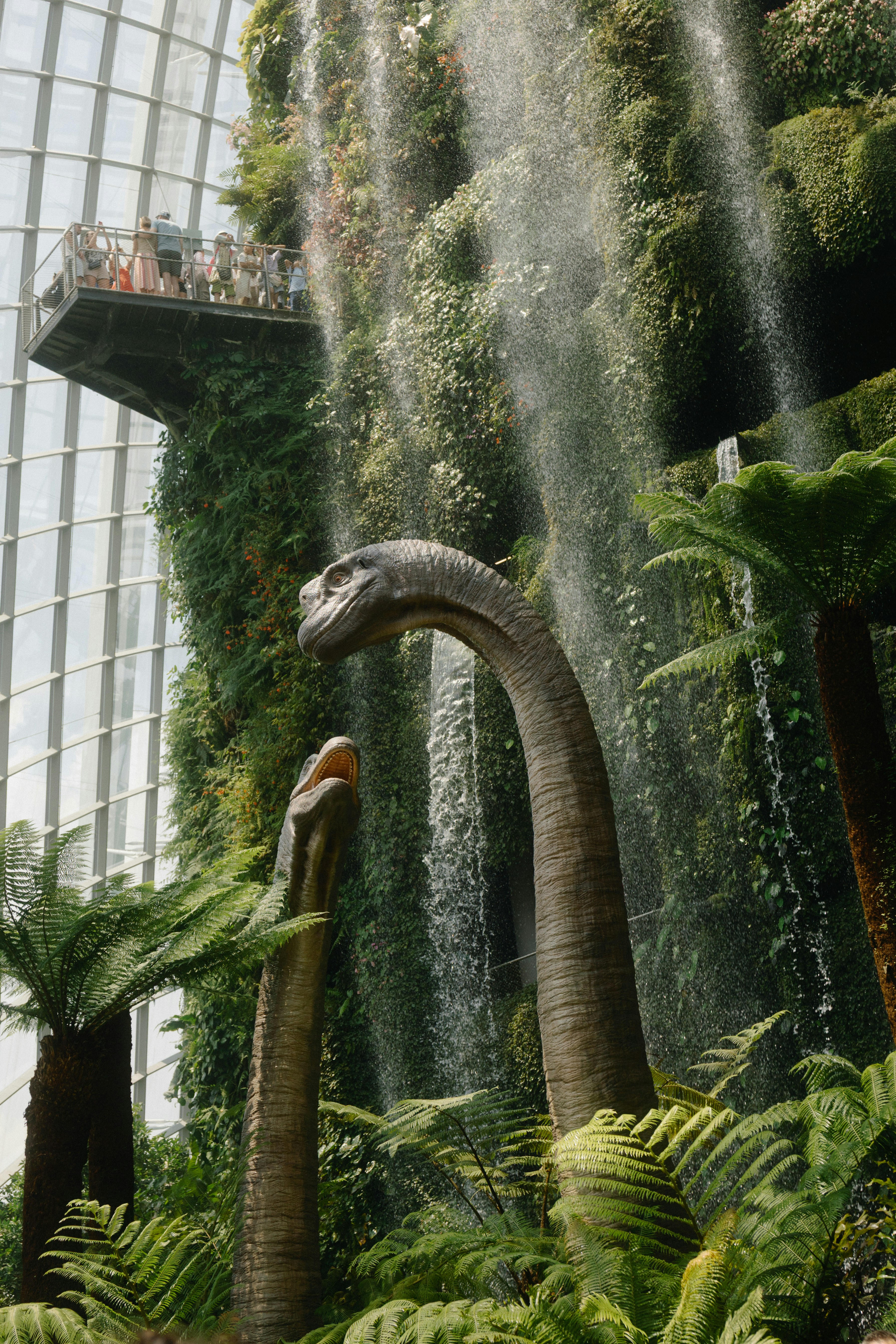 Dinosaur Giants Beneath a Mist of Indoor Rain