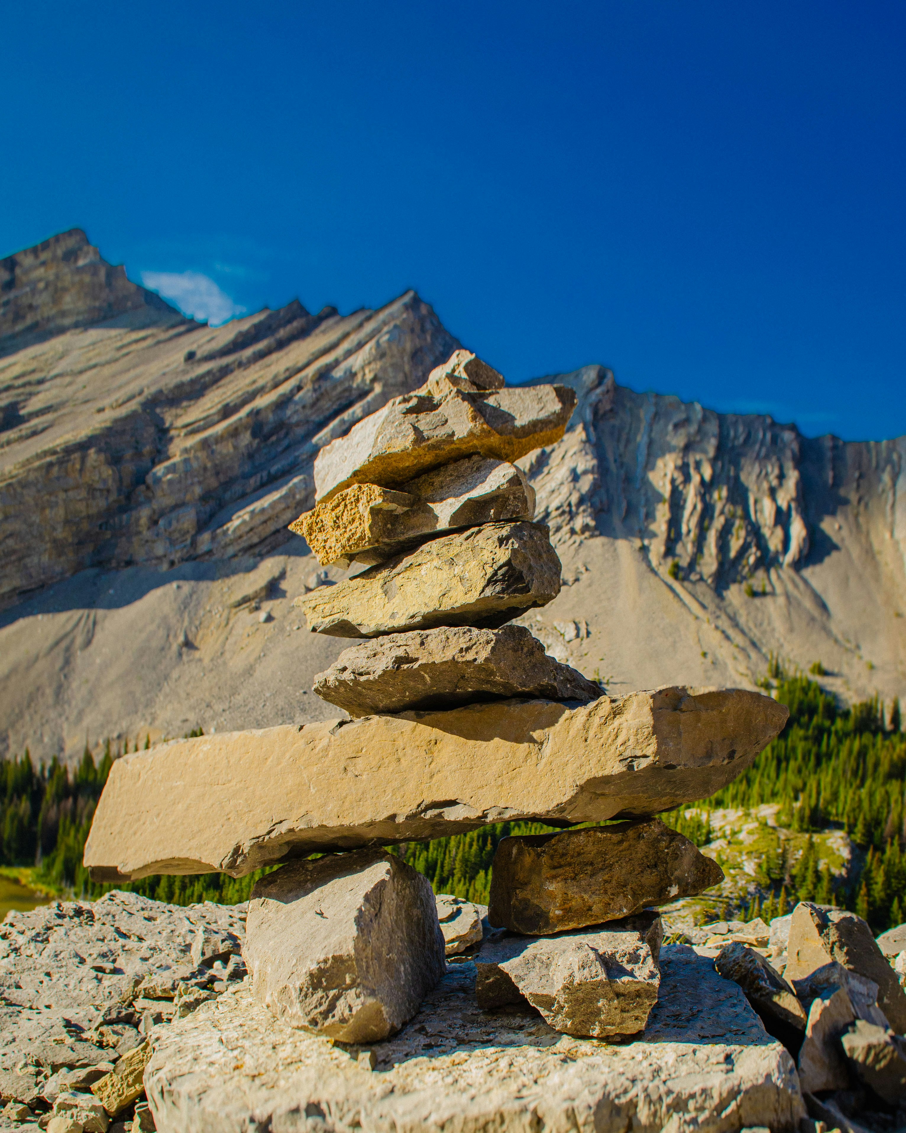 Cairn Sentinel: Stone Stack Framed by a Rugged Alpine Backdrop