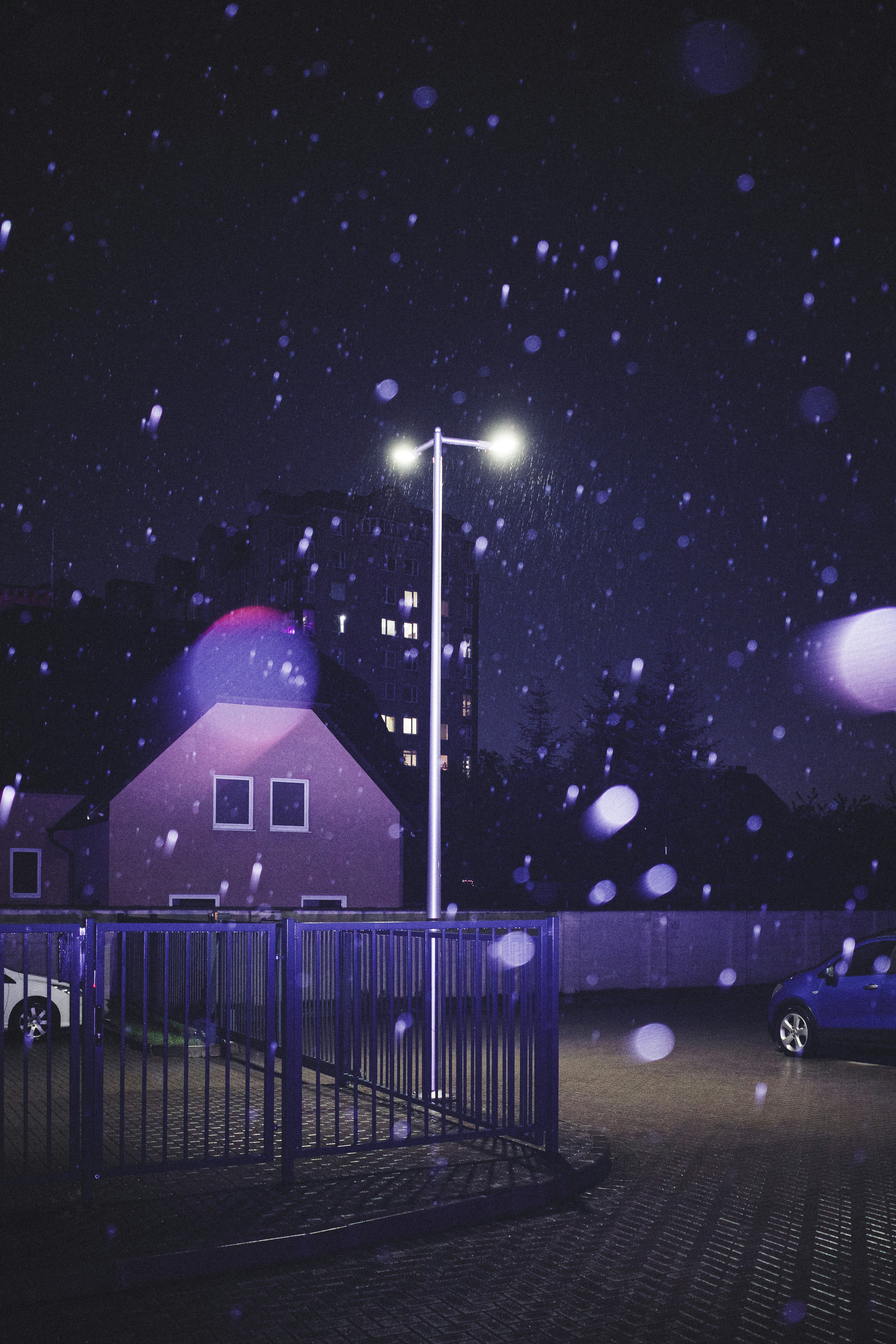 Urban Nightfall: A Dance of Light and Rain