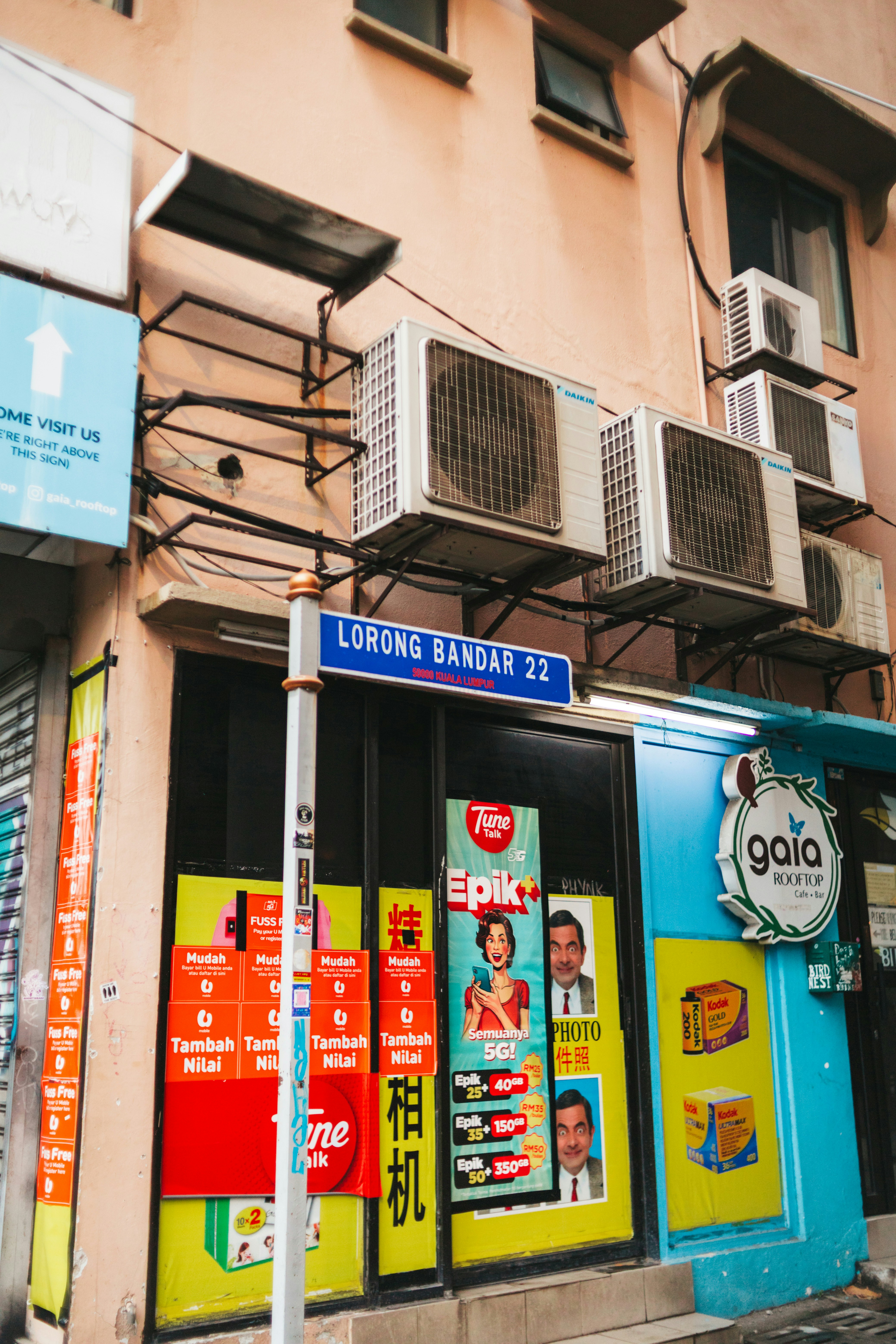 Signboard Geometry and Neon Hues: A Street-Level storefront portrait
