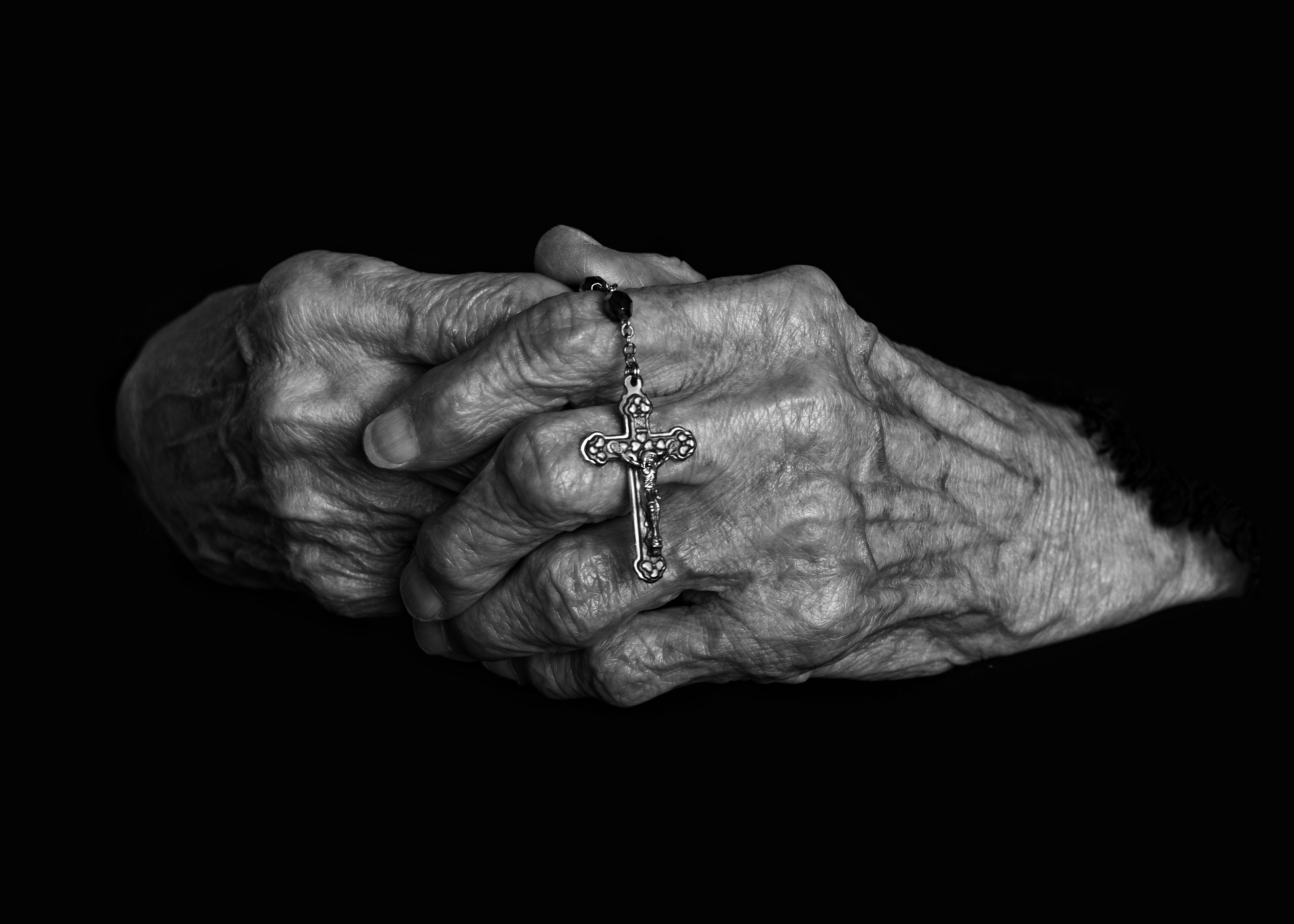 Two hands clasped together in solidarity