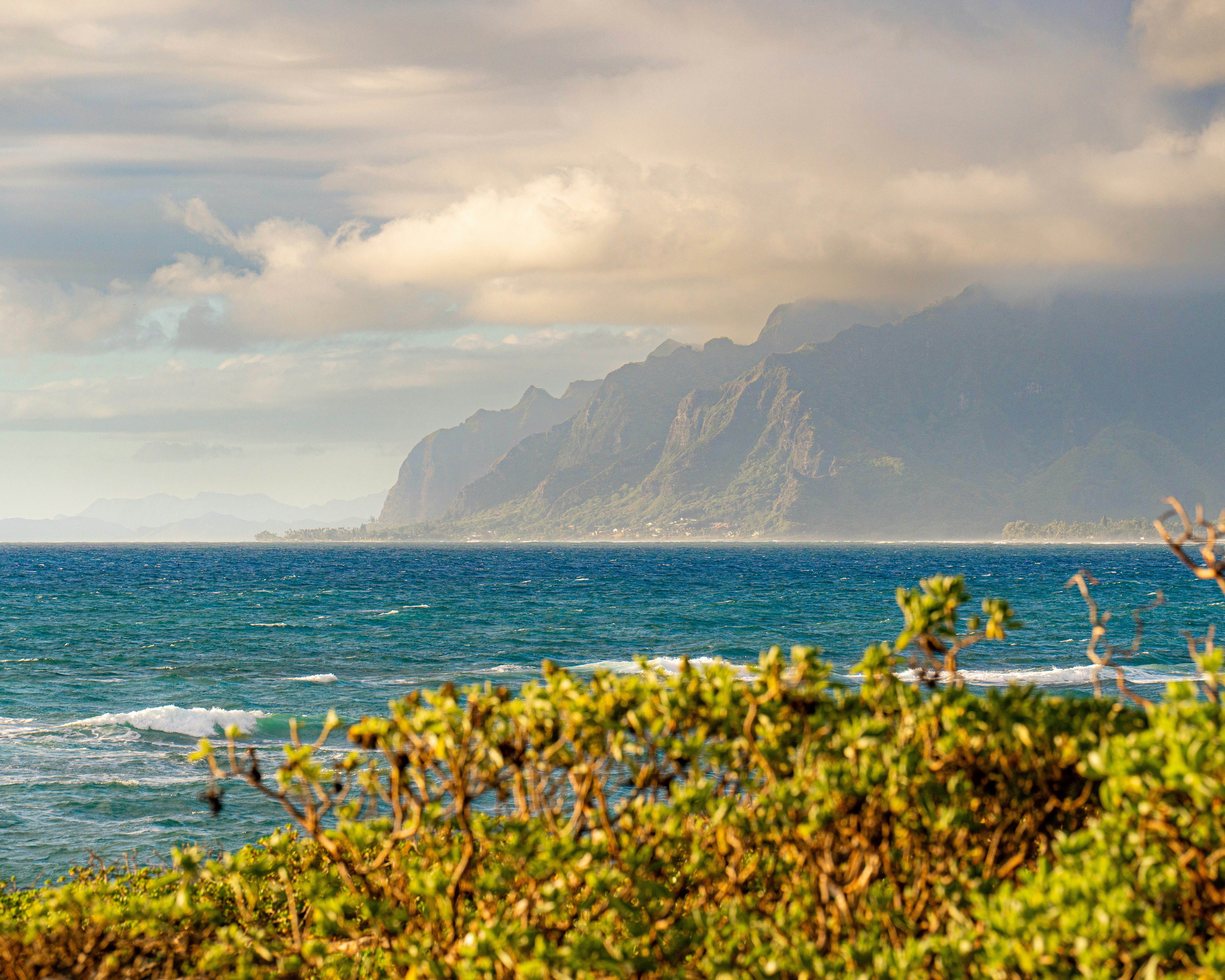 Coastal landscape with ocean and distant mountains