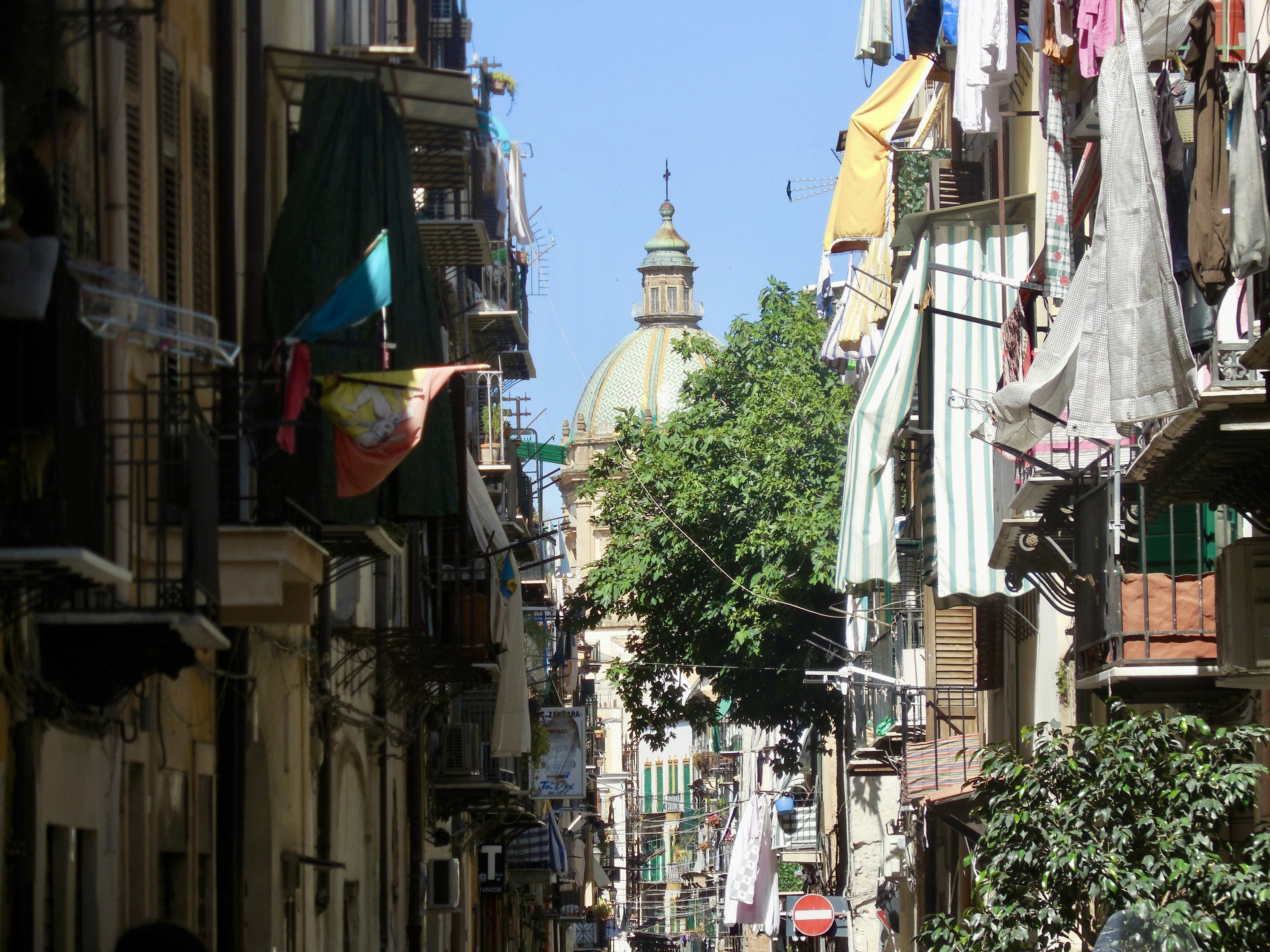 Buildings with laundry hanging between them