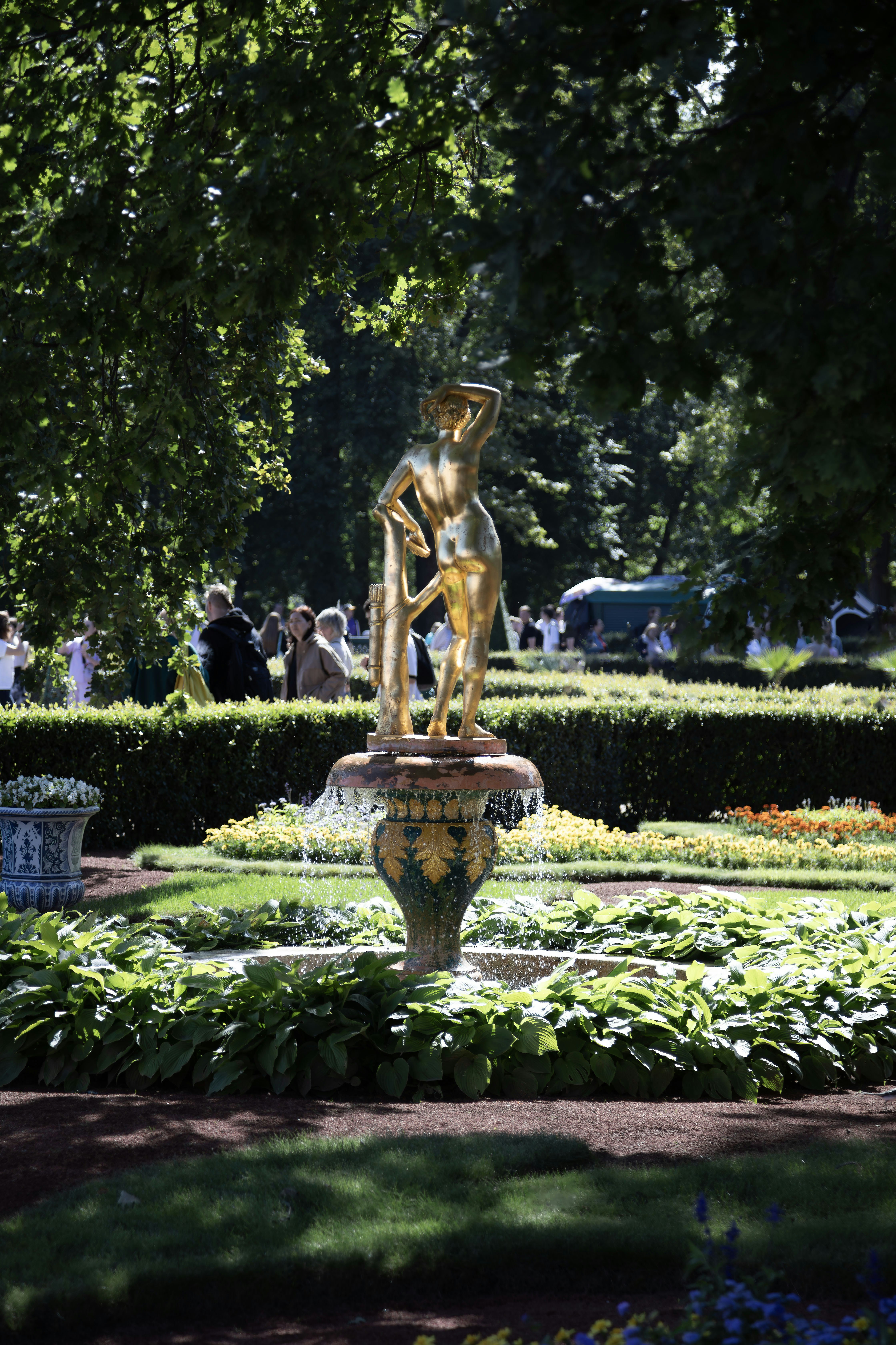 Peterhof | Golden statue in a lush green park garden