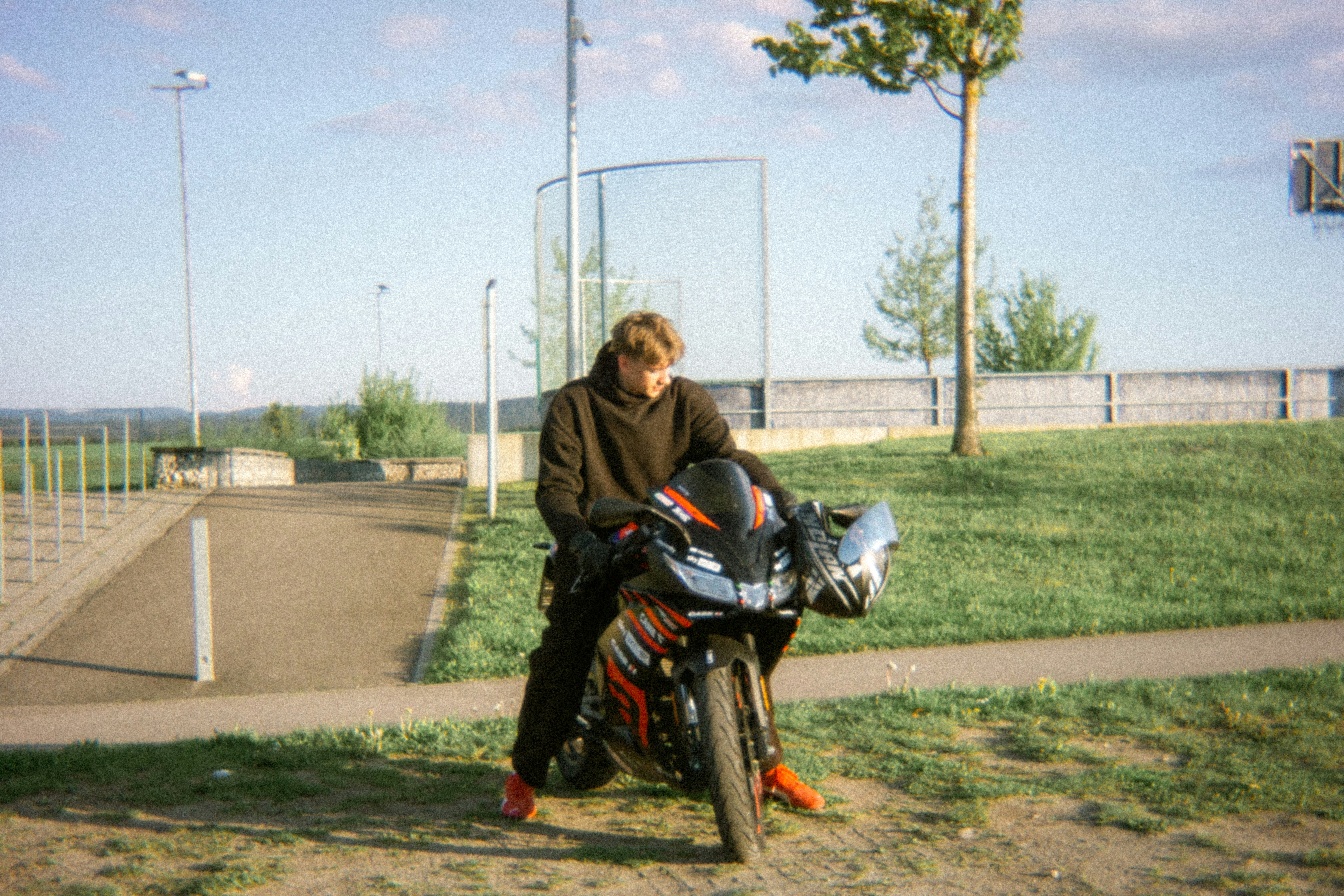 Woman with long hair sitting on a motorcycle