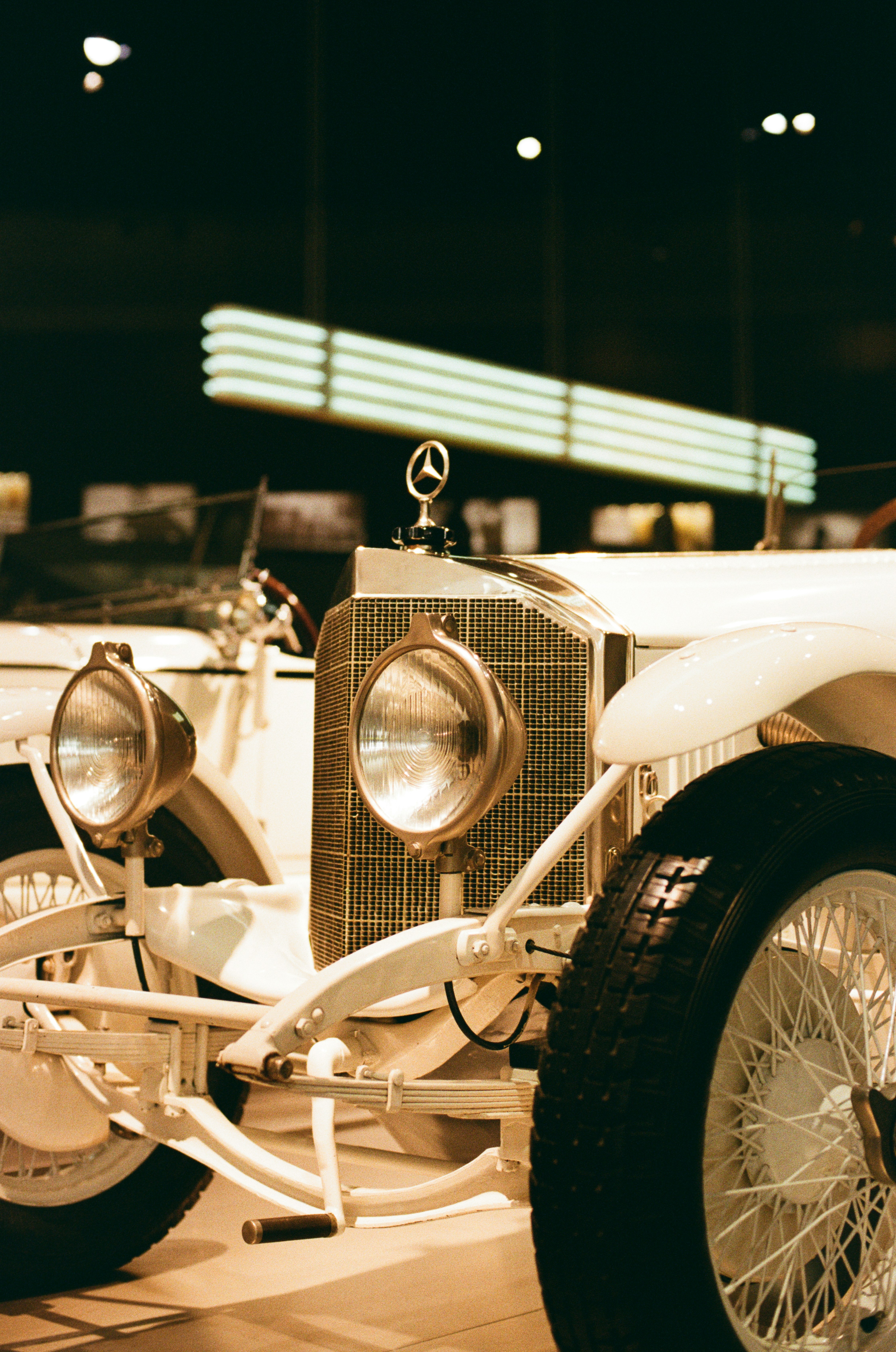Vintage car with ornate grille and headlights