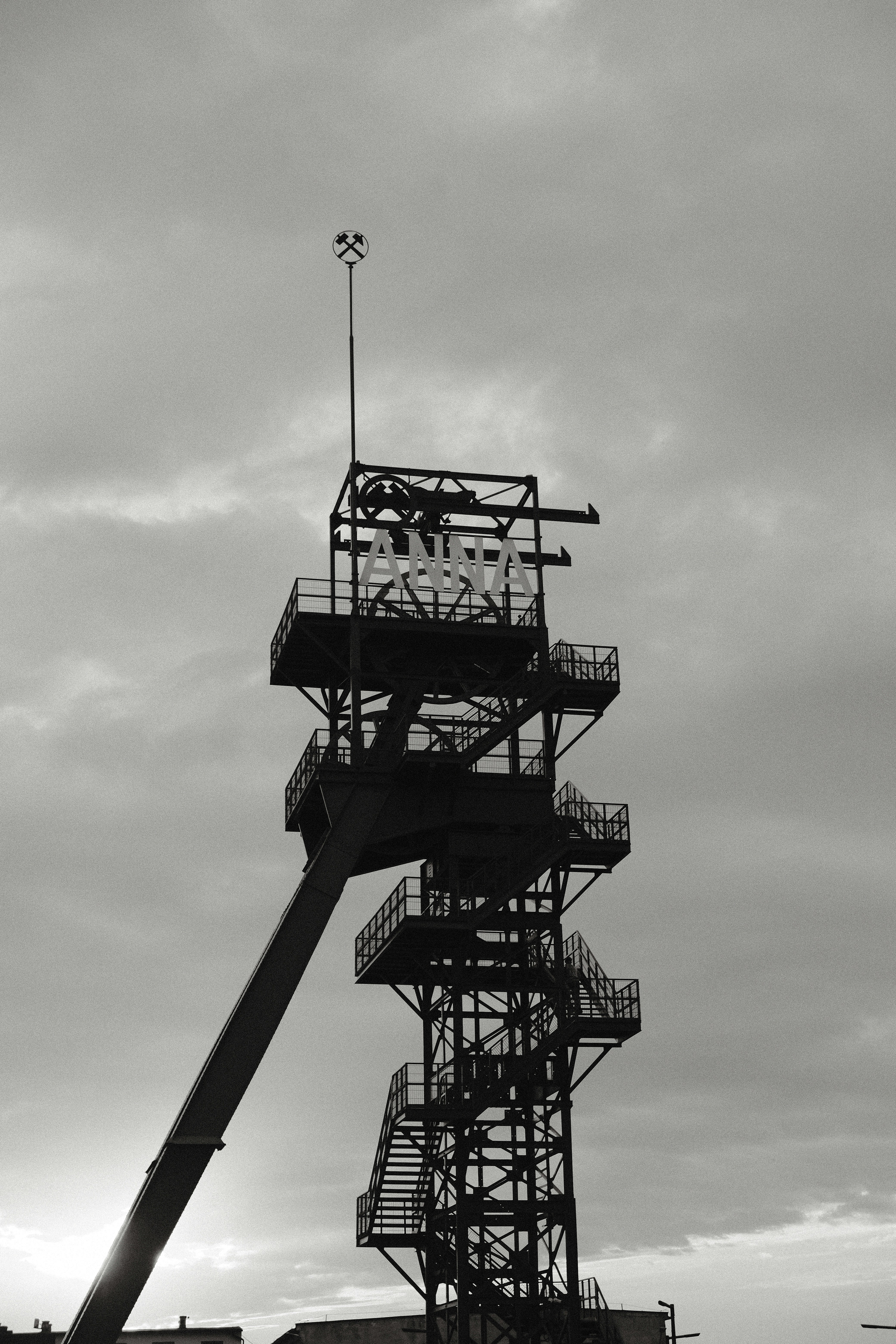 Industrial tower against a cloudy sky