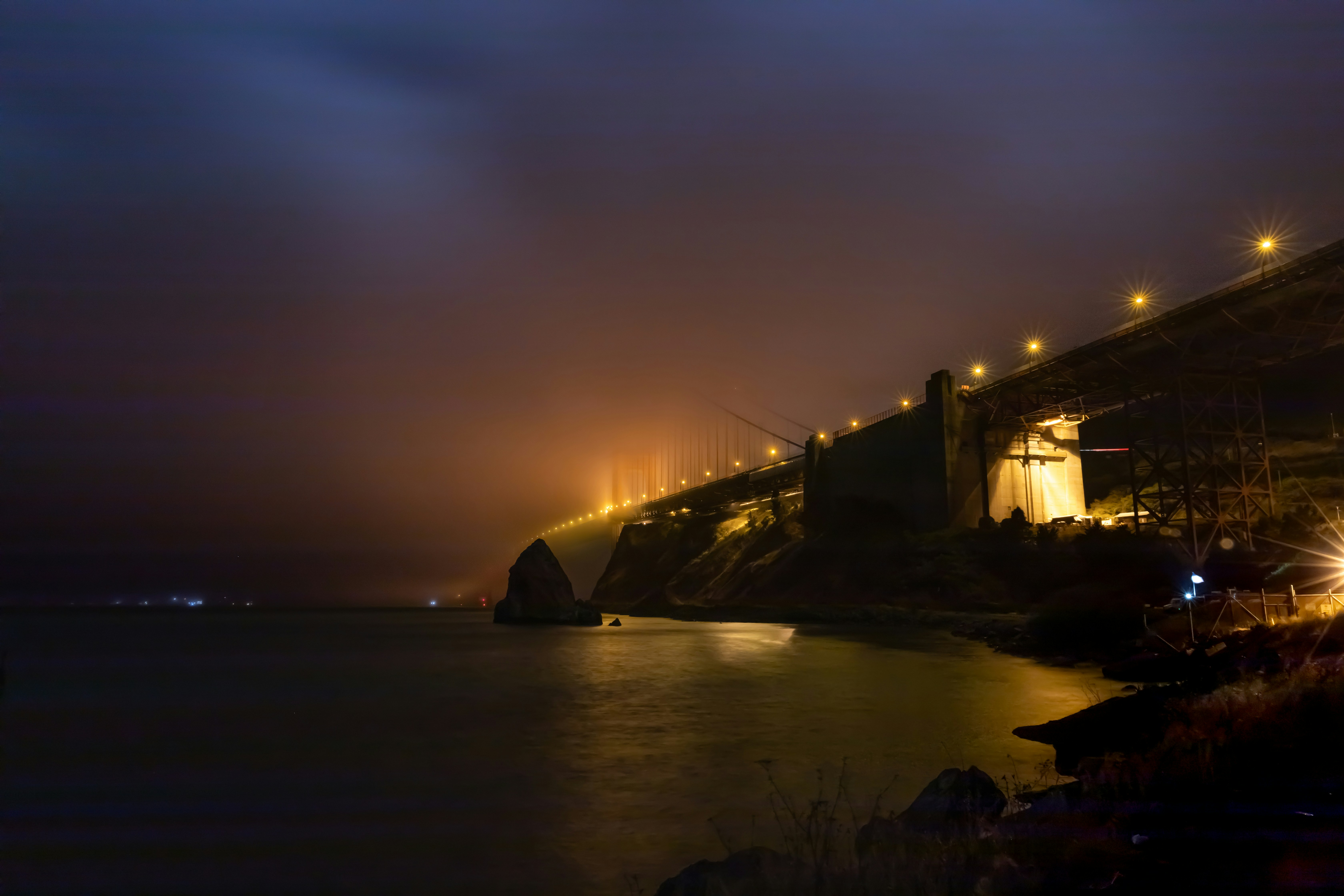 Fog-Wrapped Bridge of Night Light