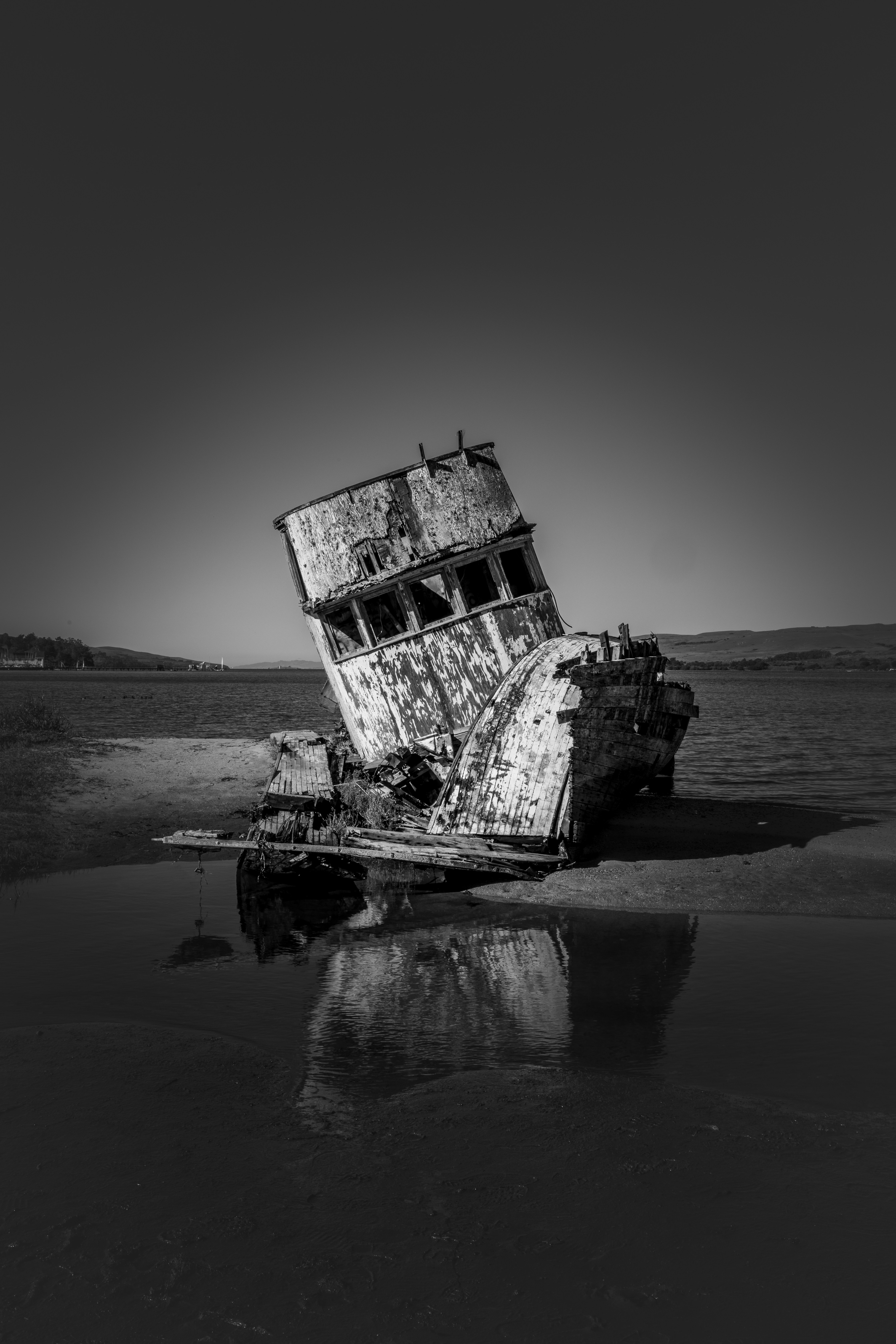 Tilted Ghost Ship: A Monochrome Shoreline of Time