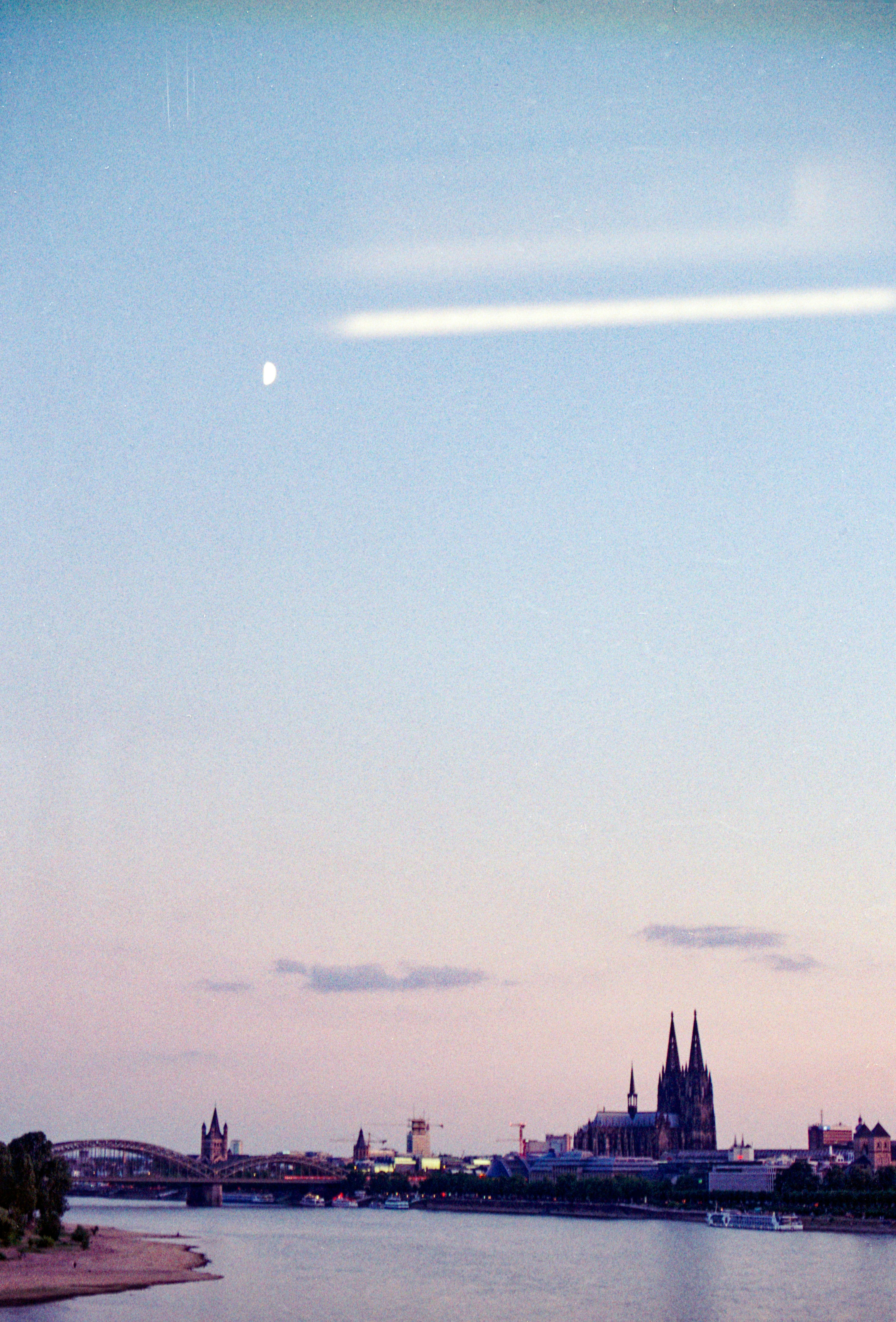 City skyline with river and cathedral at dusk