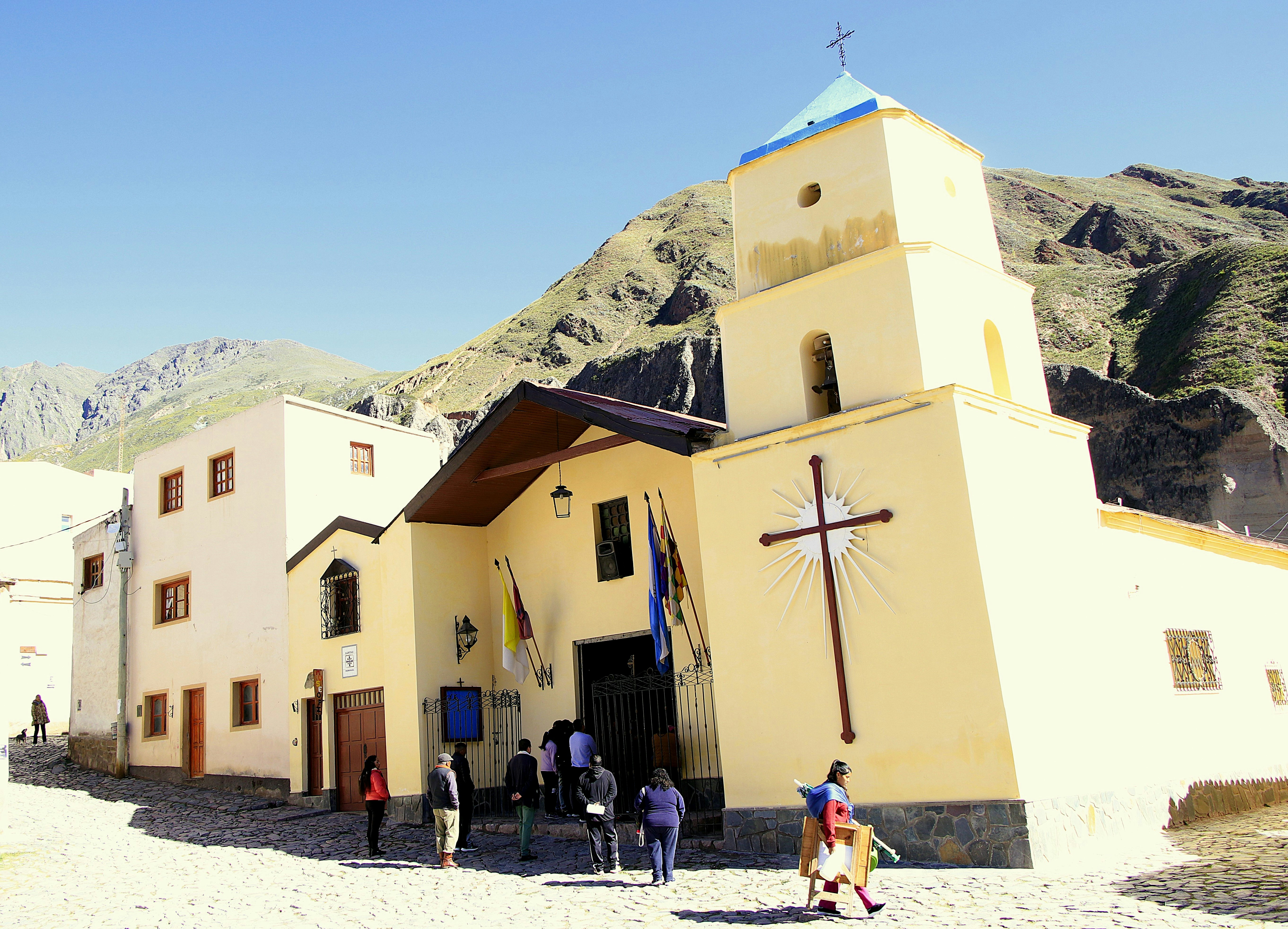 Iruya | A yellow building with a cross on a sunny day
