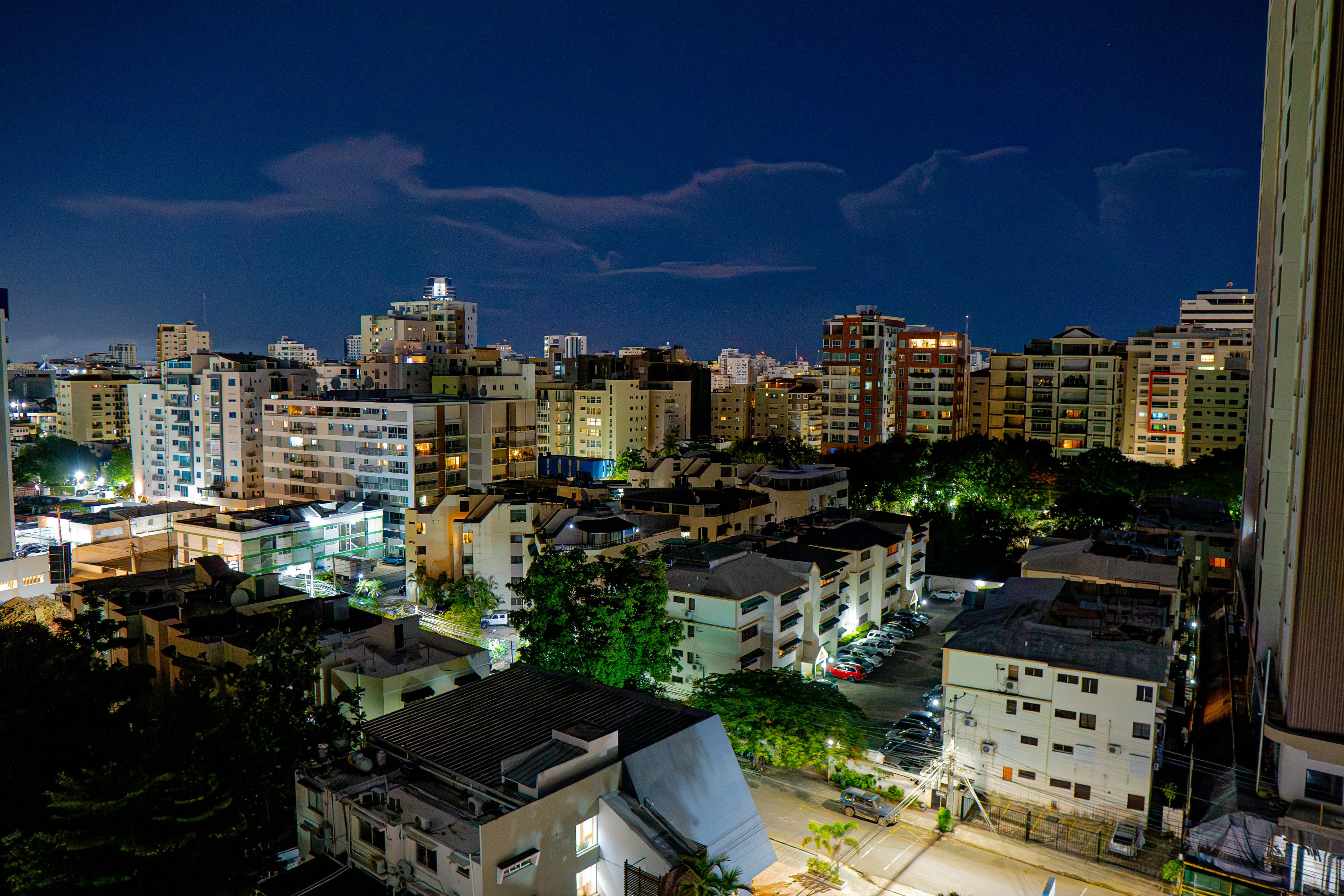 City skyline illuminated at night with buildings and lights