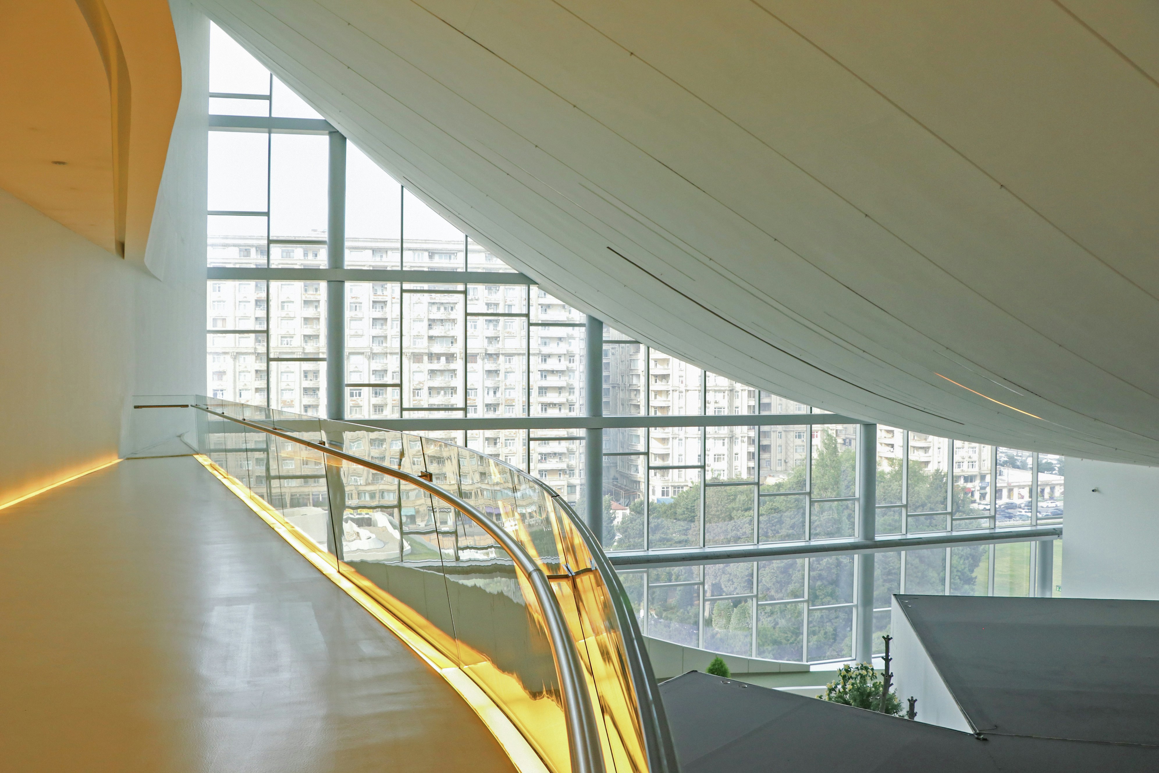Golden buddha statue against modern architecture