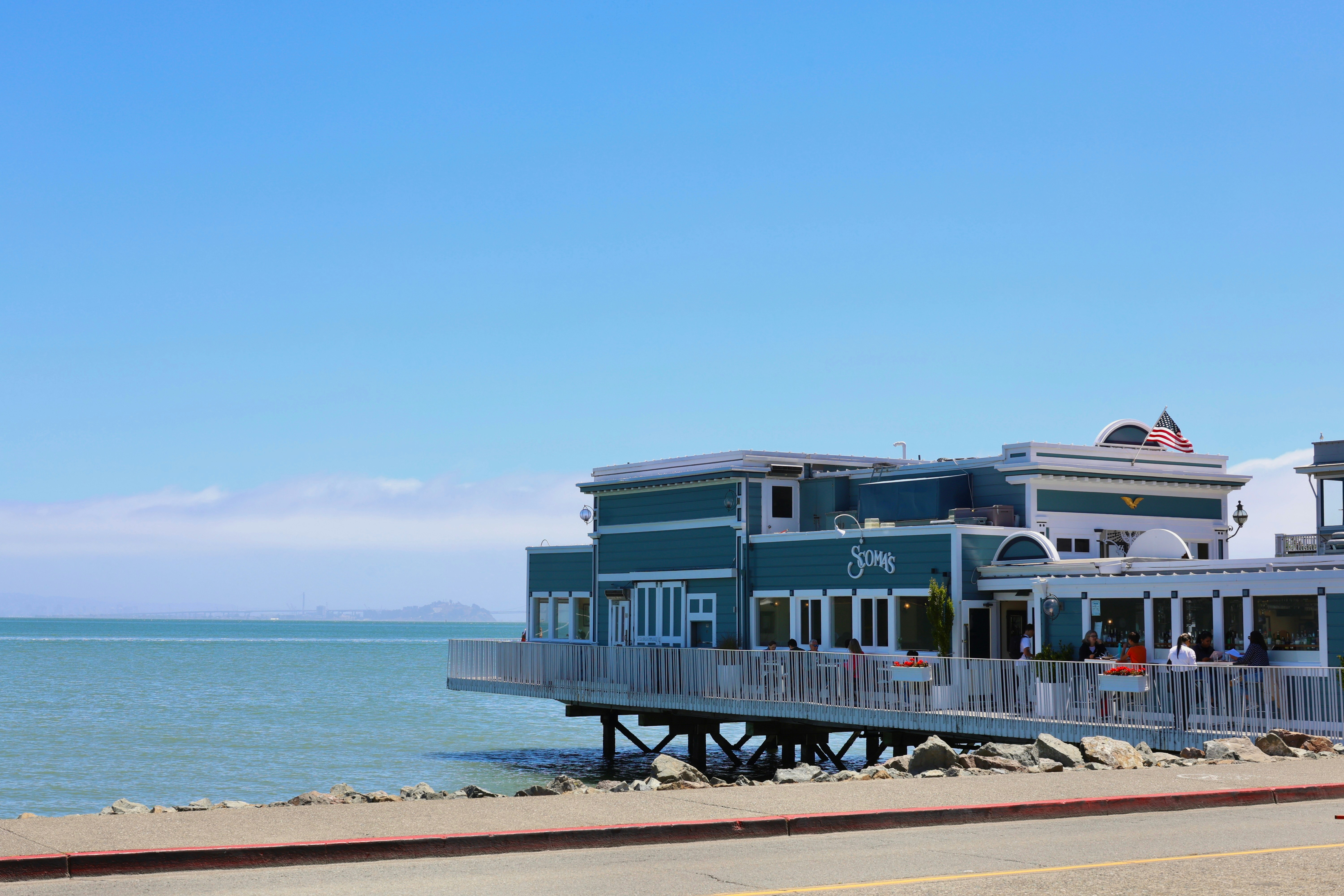 Pierfront Café Over Calm Blue Water