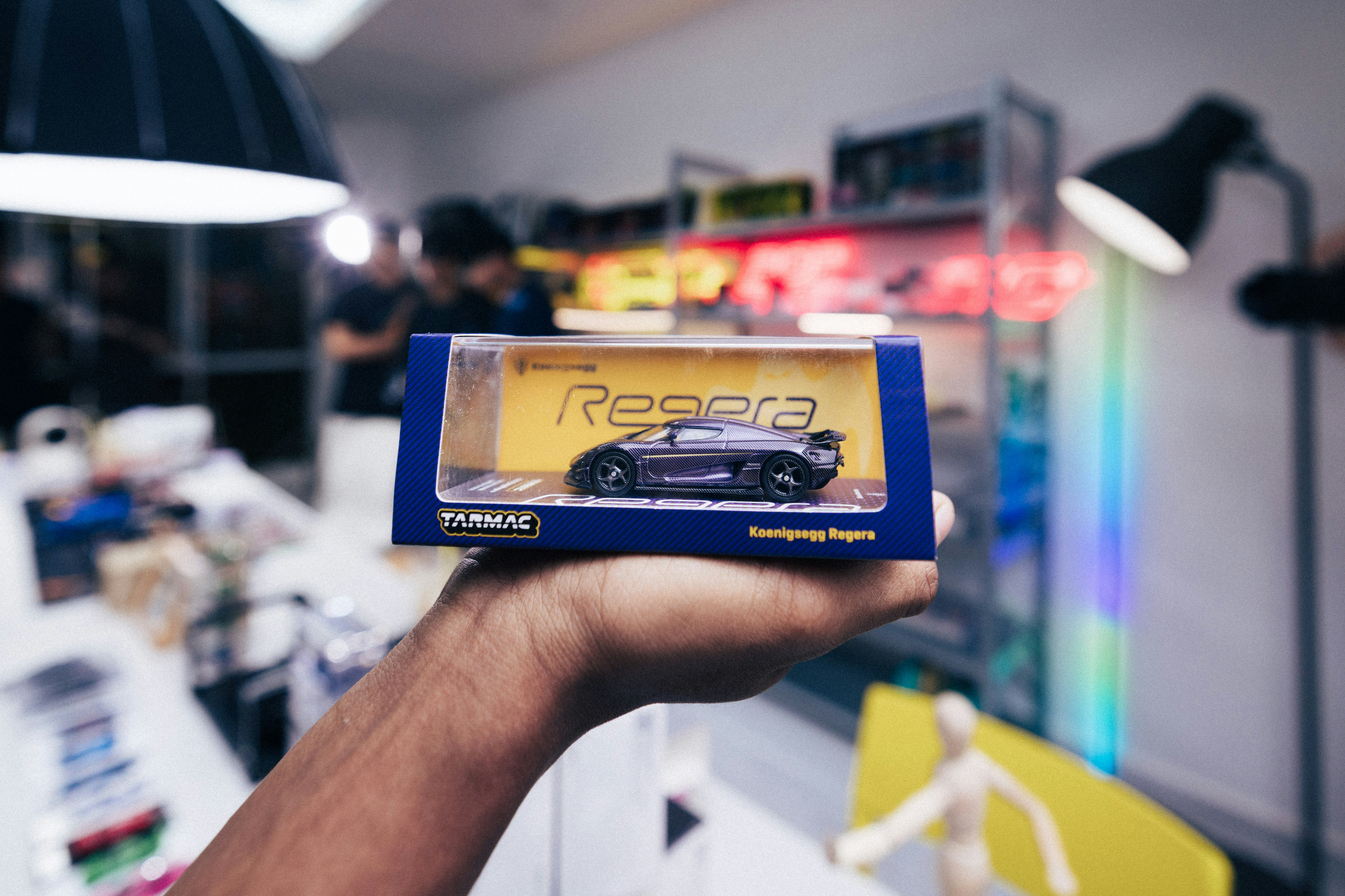 Car event meeting at RC Cambodia | Hand holding a model car in its packaging