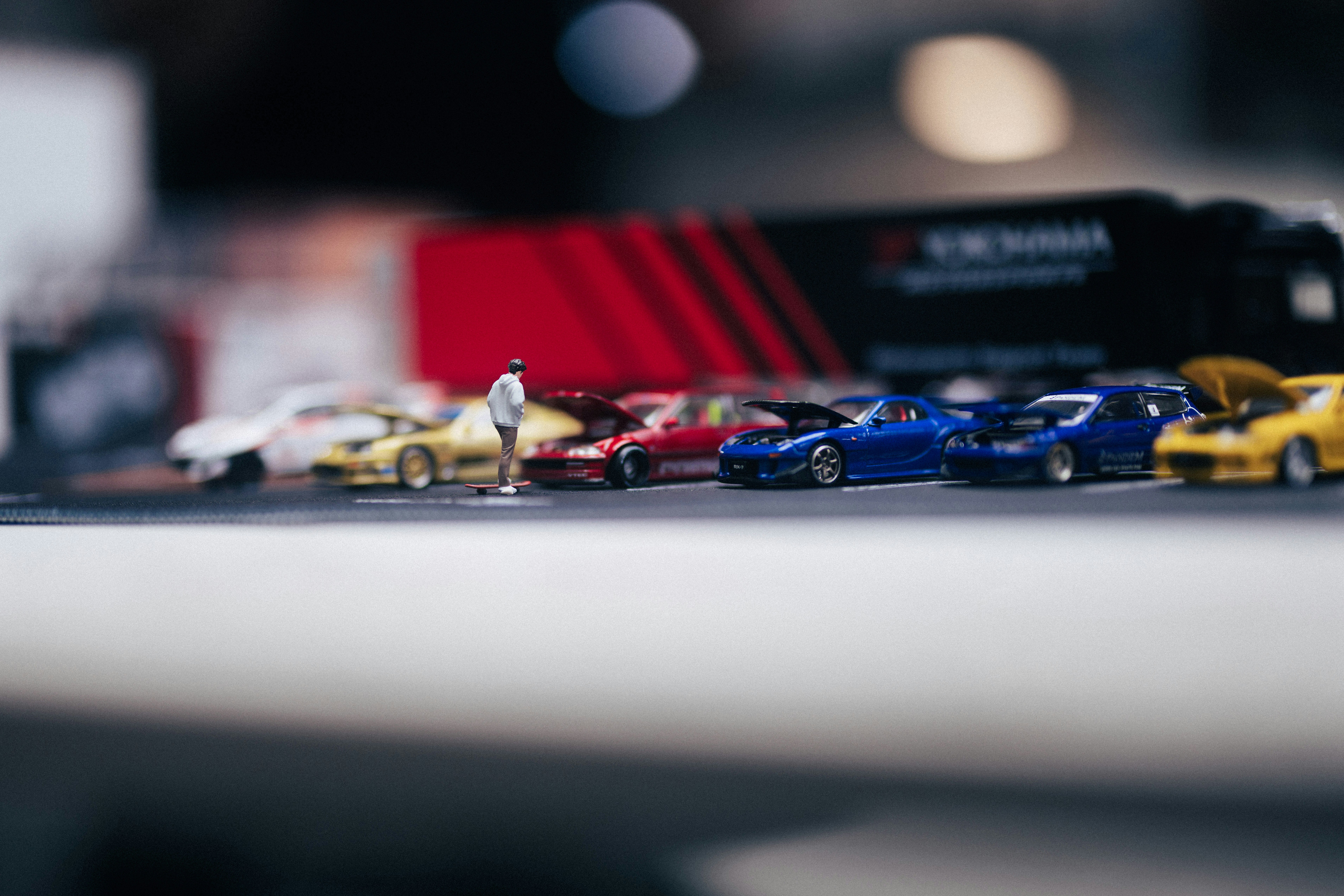 Car event meeting at RC Cambodia | Several colorful toy cars lined up in a row.