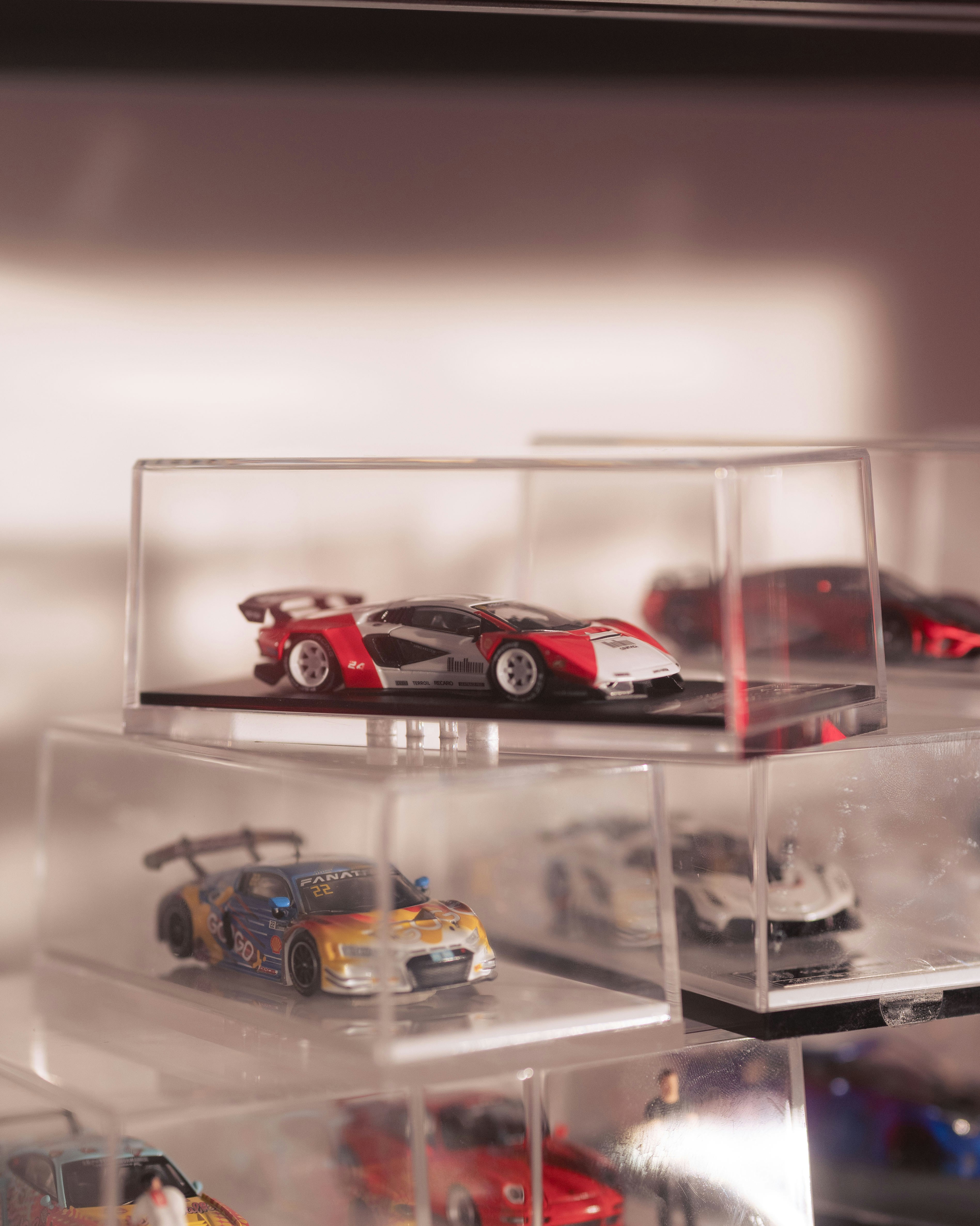 car model decoration | Model race cars displayed in clear cases