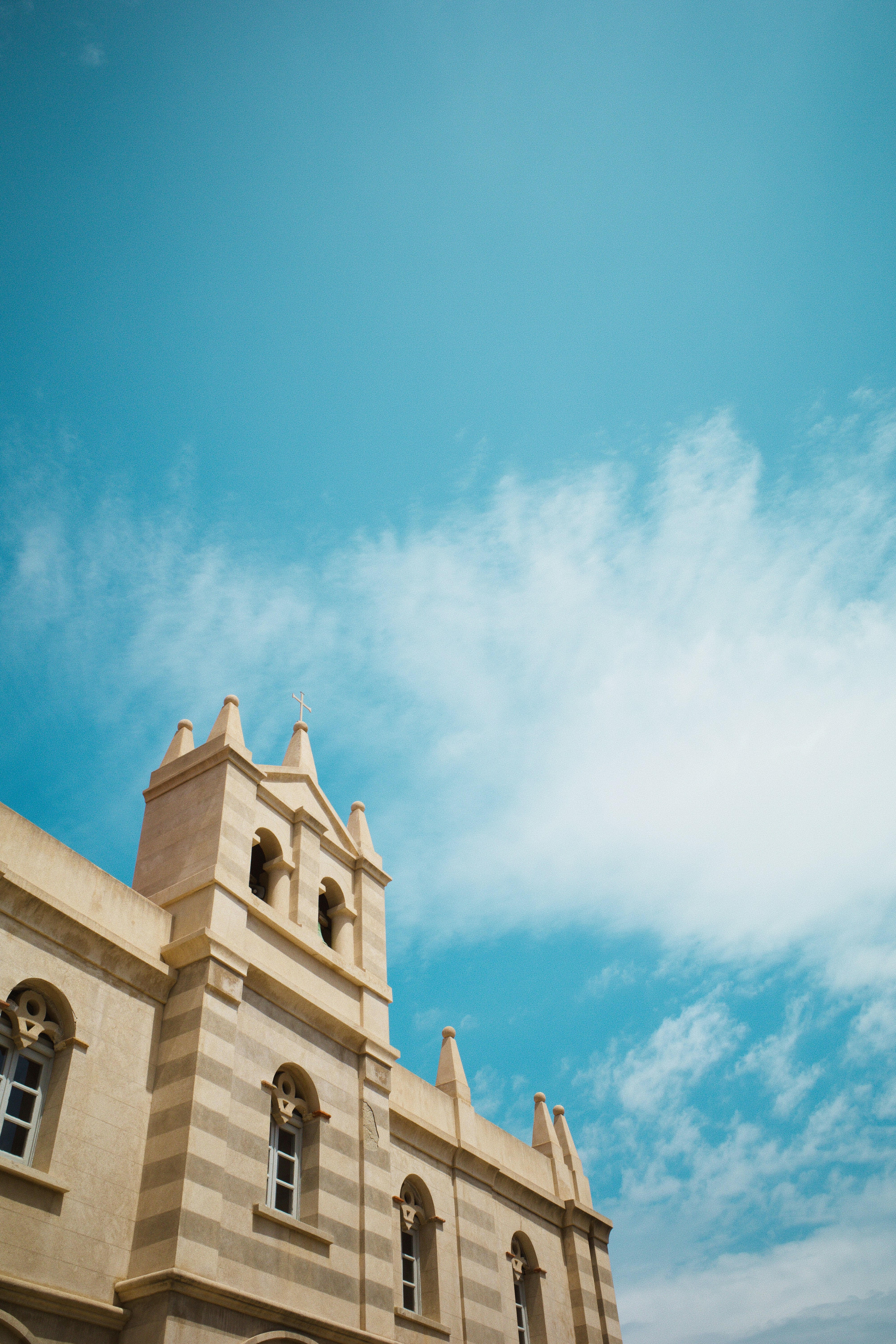 Ornate building facade against a bright blue sky.
