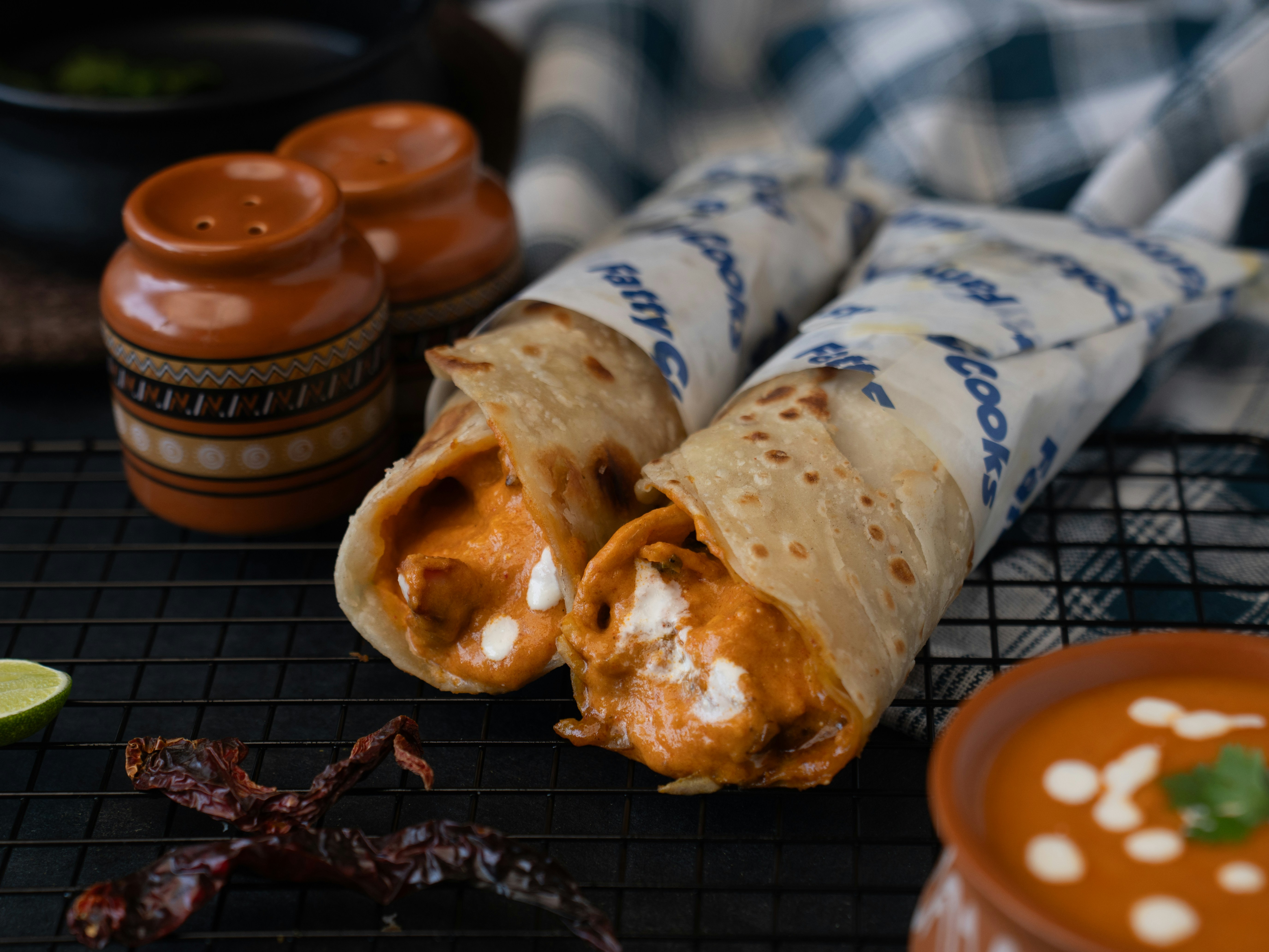 Two delicious wraps filled with creamy sauce.