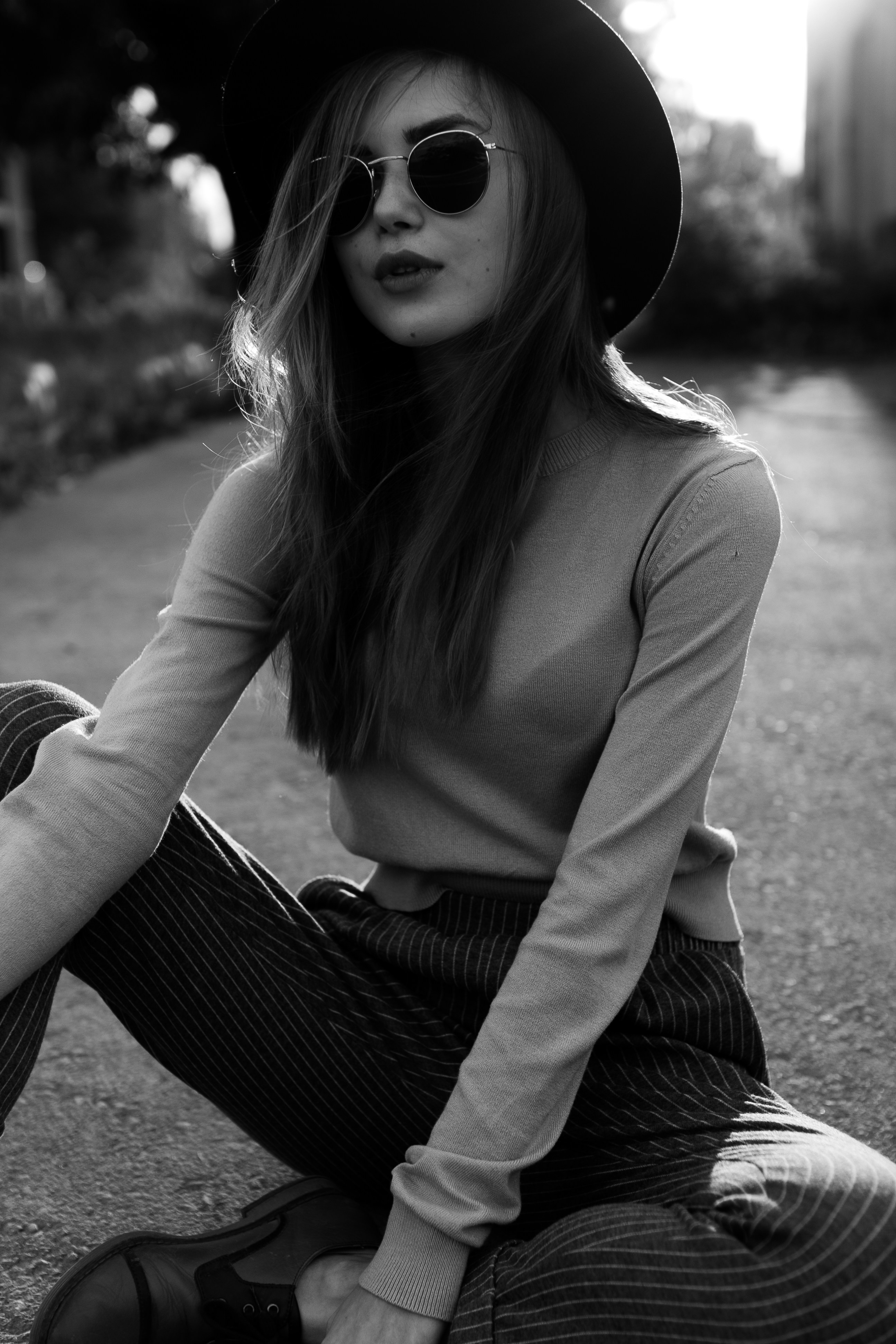 Woman wearing sunglasses and hat outdoors