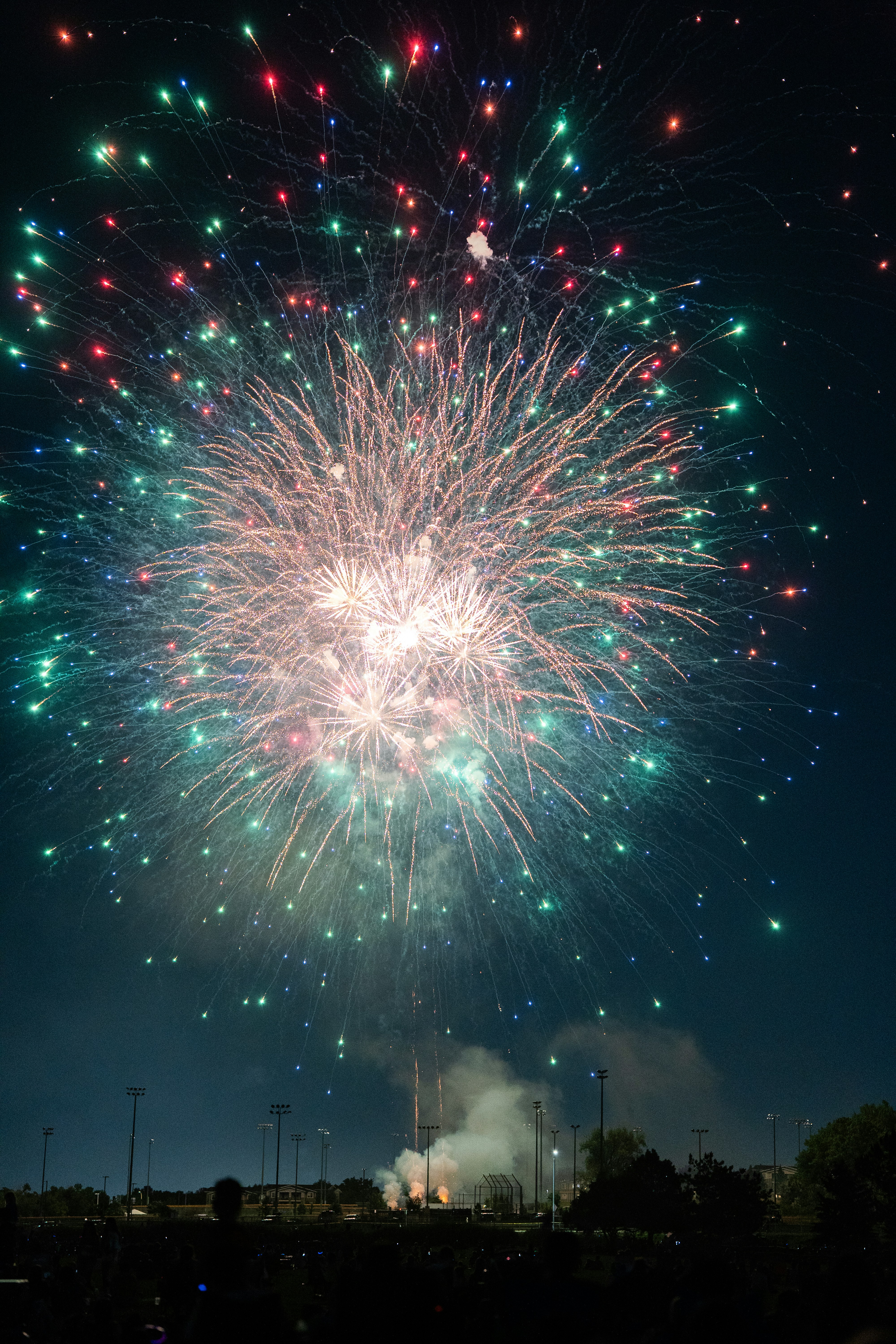 Fireworks Show in Arvada, CO | Colorful fireworks explode in the night sky.