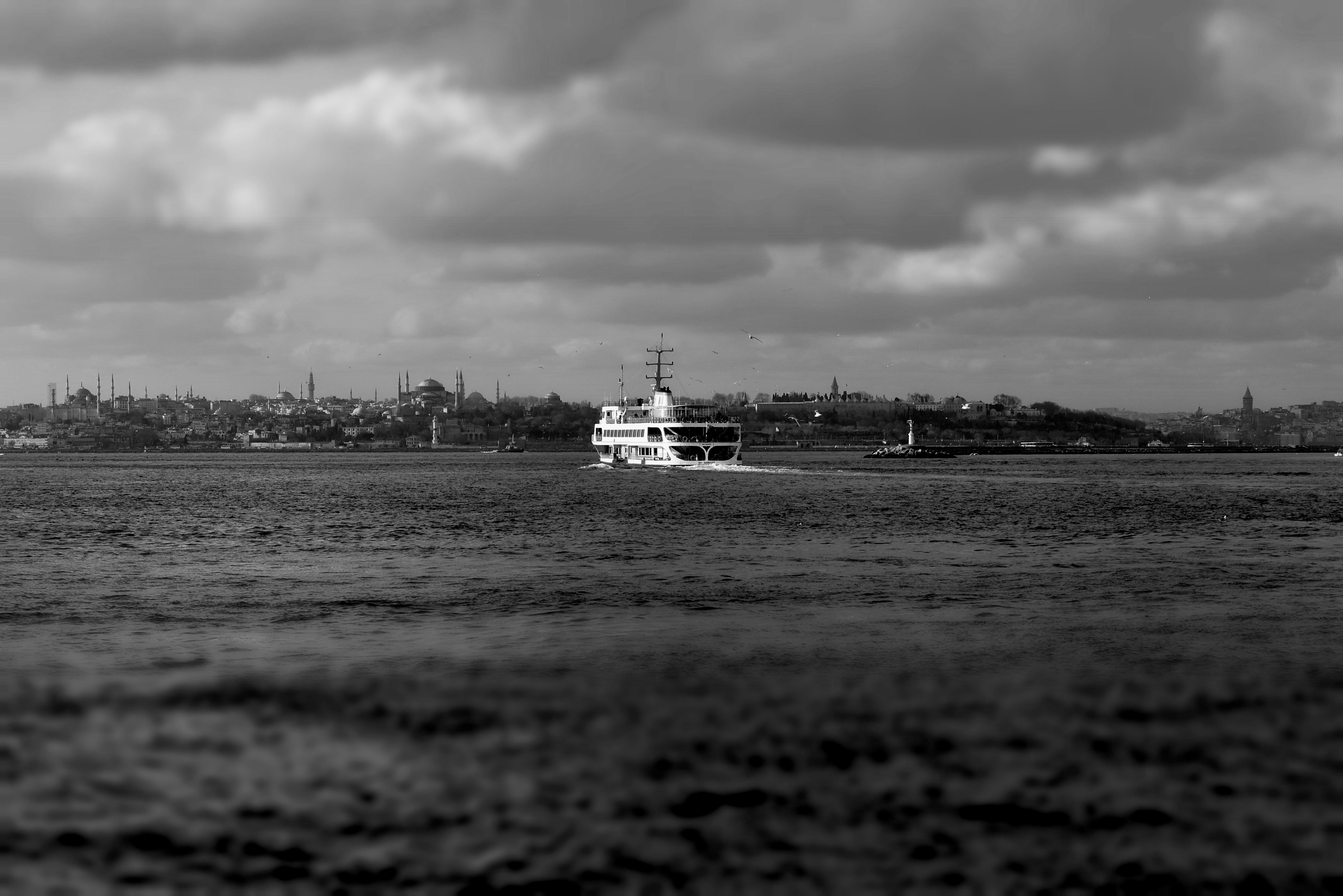A distant white building under a cloudy sky.