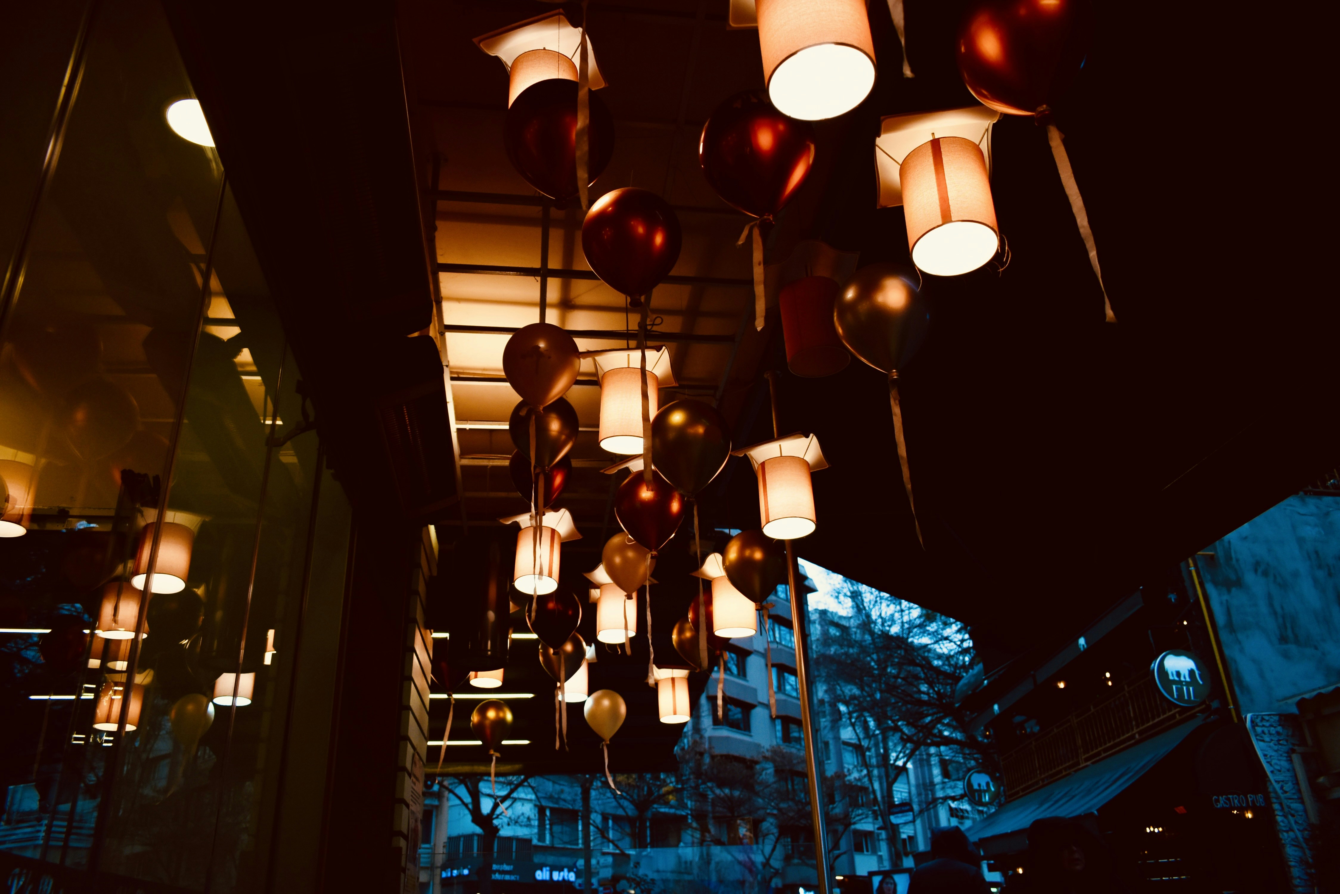 Modern chandelier with glowing lights in dark room