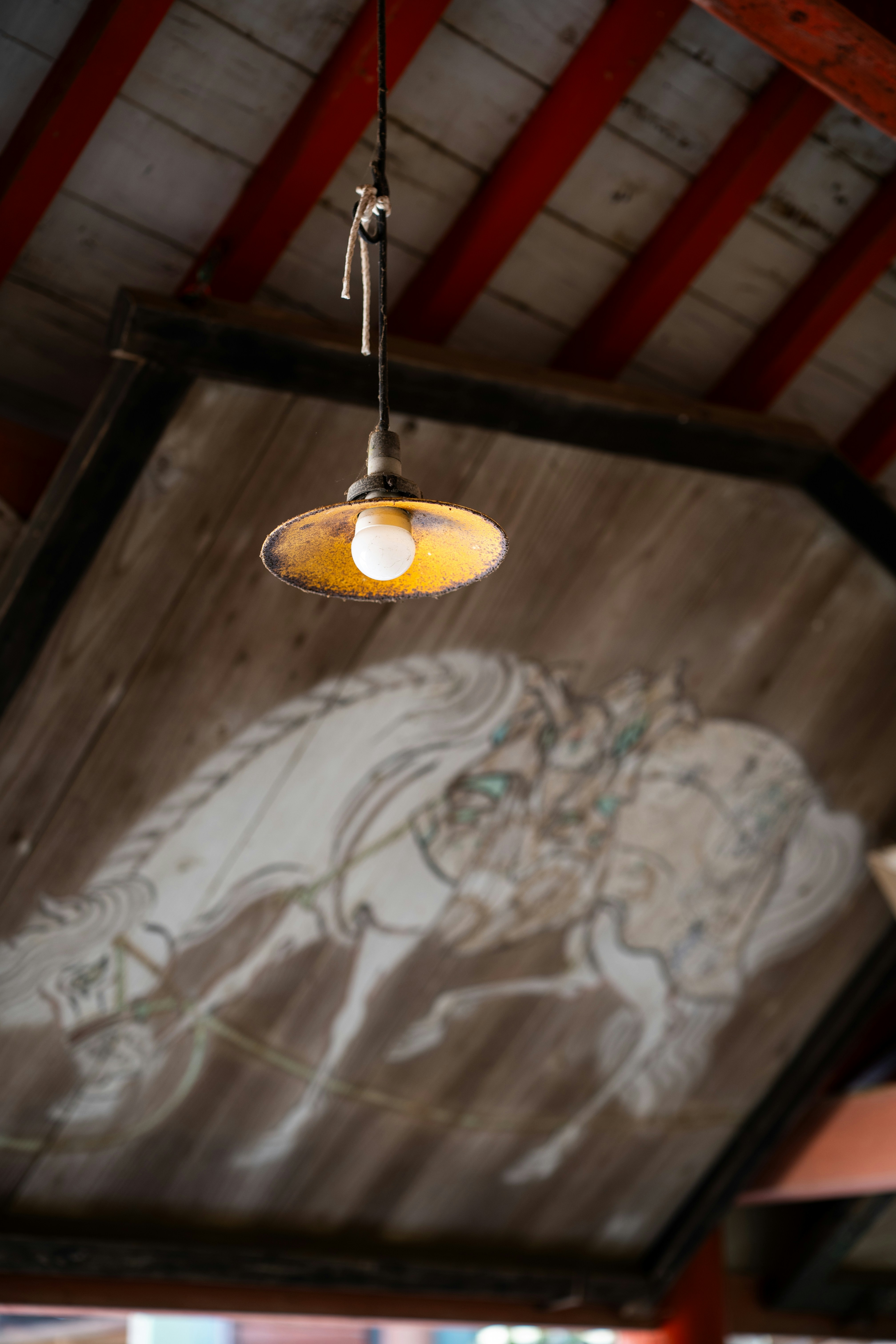 Lonely Edison: A Glowing Bulb Under a Rustic Lantern