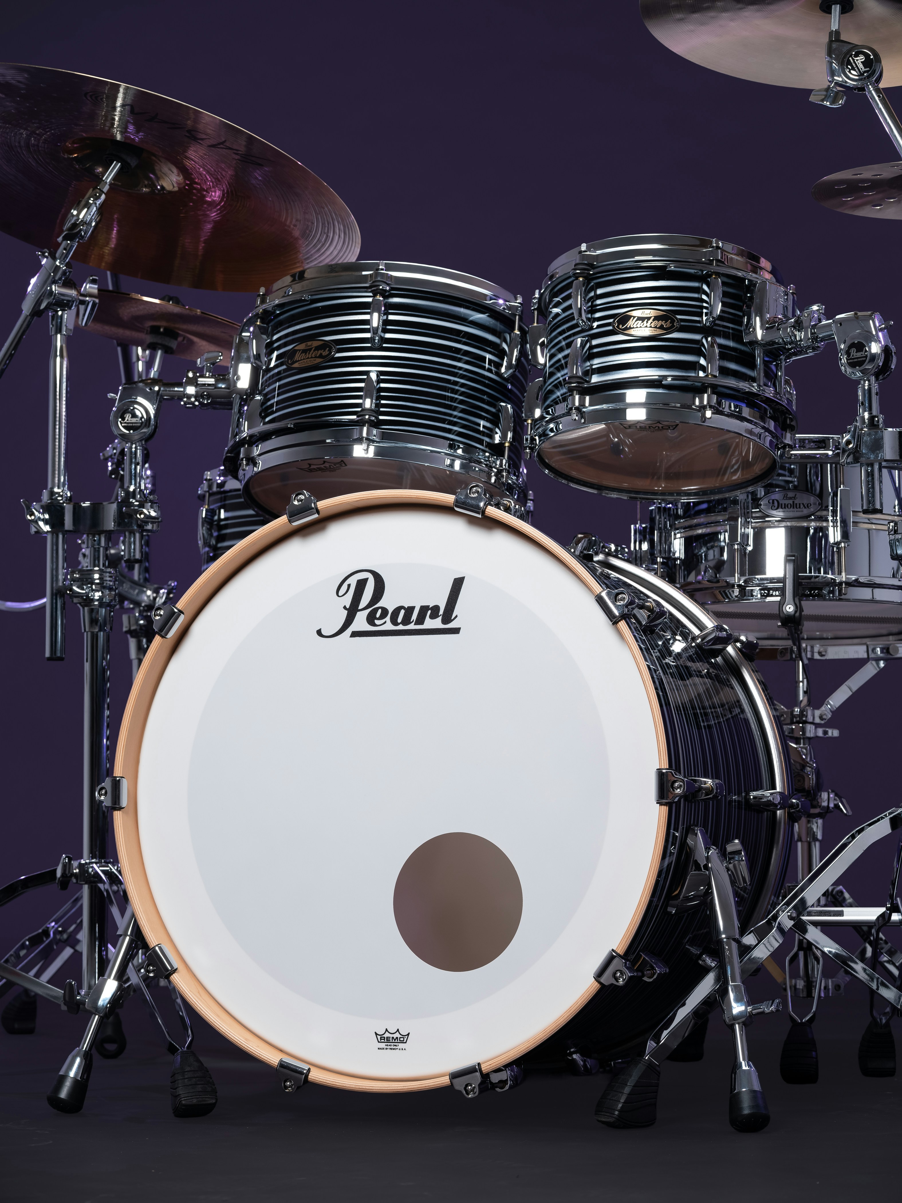 A close-up of a pearl drum set on a purple background photo – Free ...
