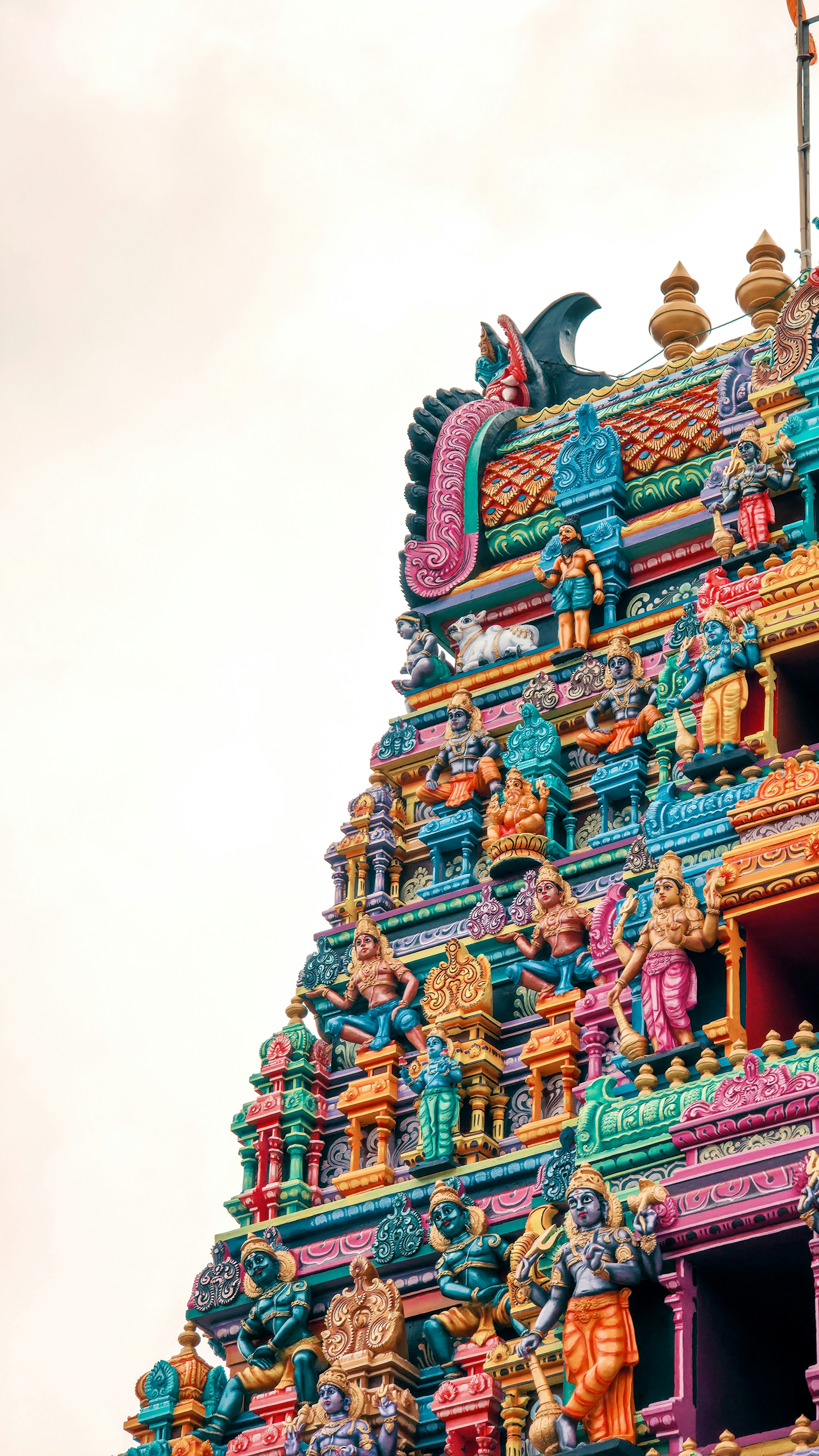 Colorful hindu temple tower with many statues