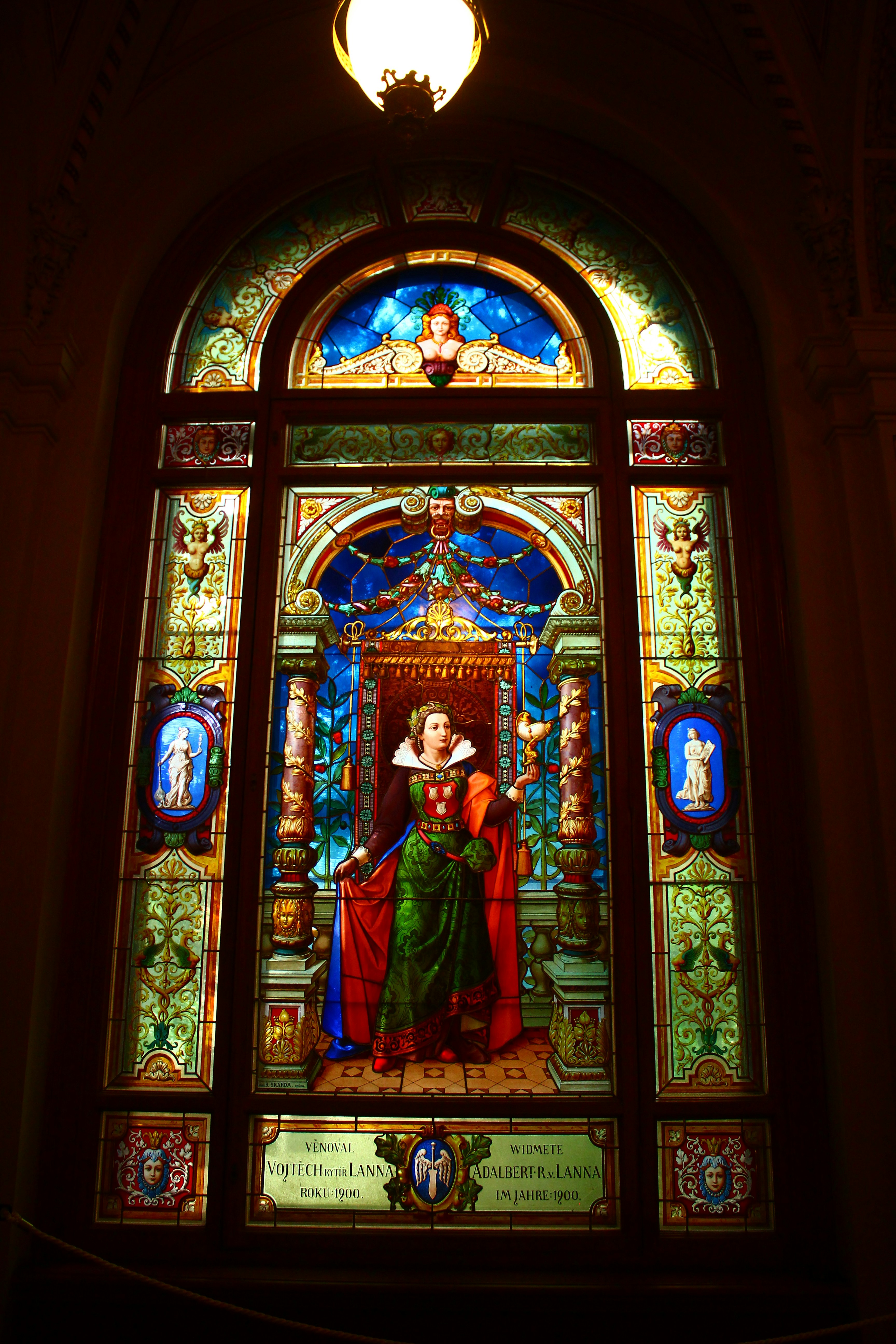 Stained glass window depicting a royal figure