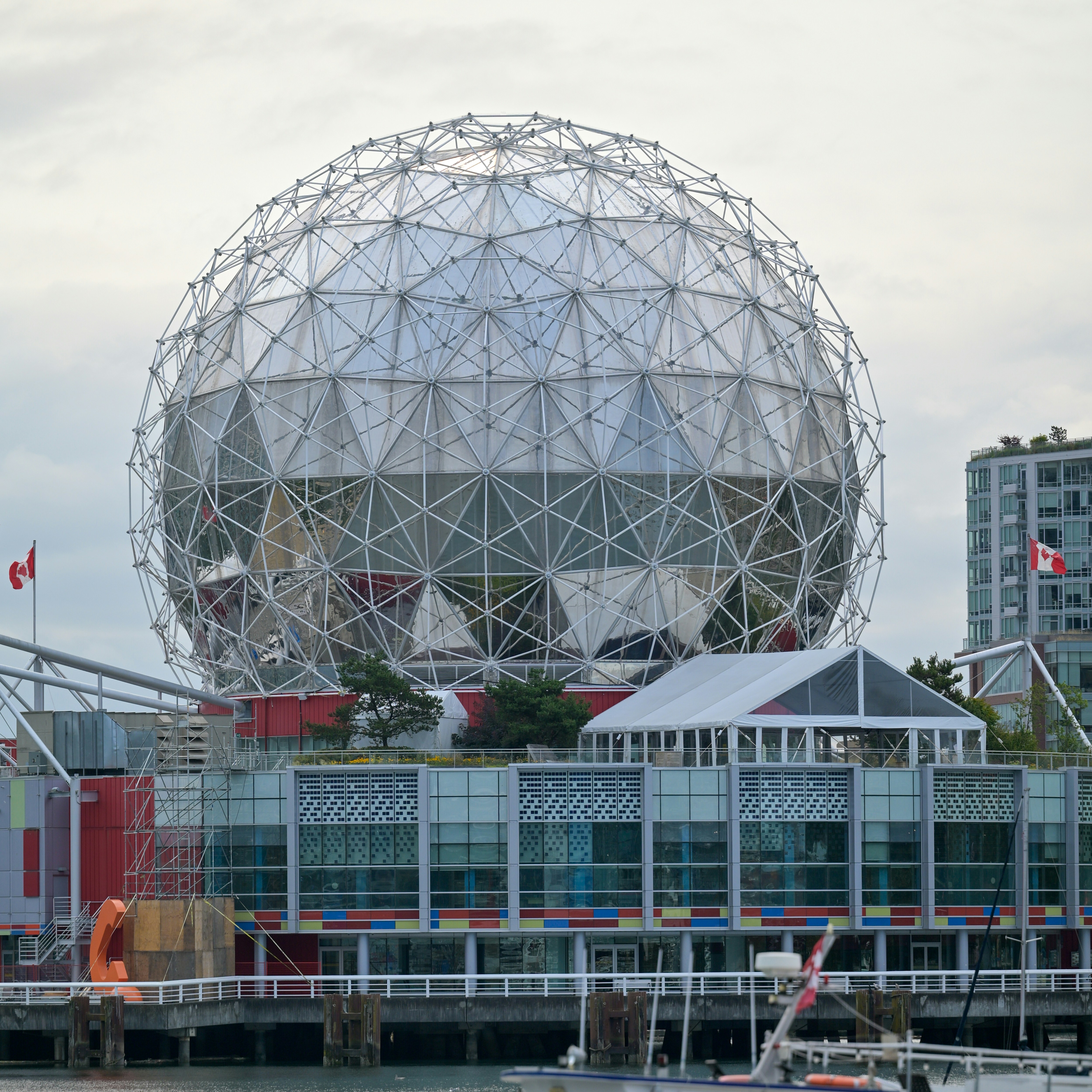Modern geodesic dome building with waterfront view of harbor photo ...