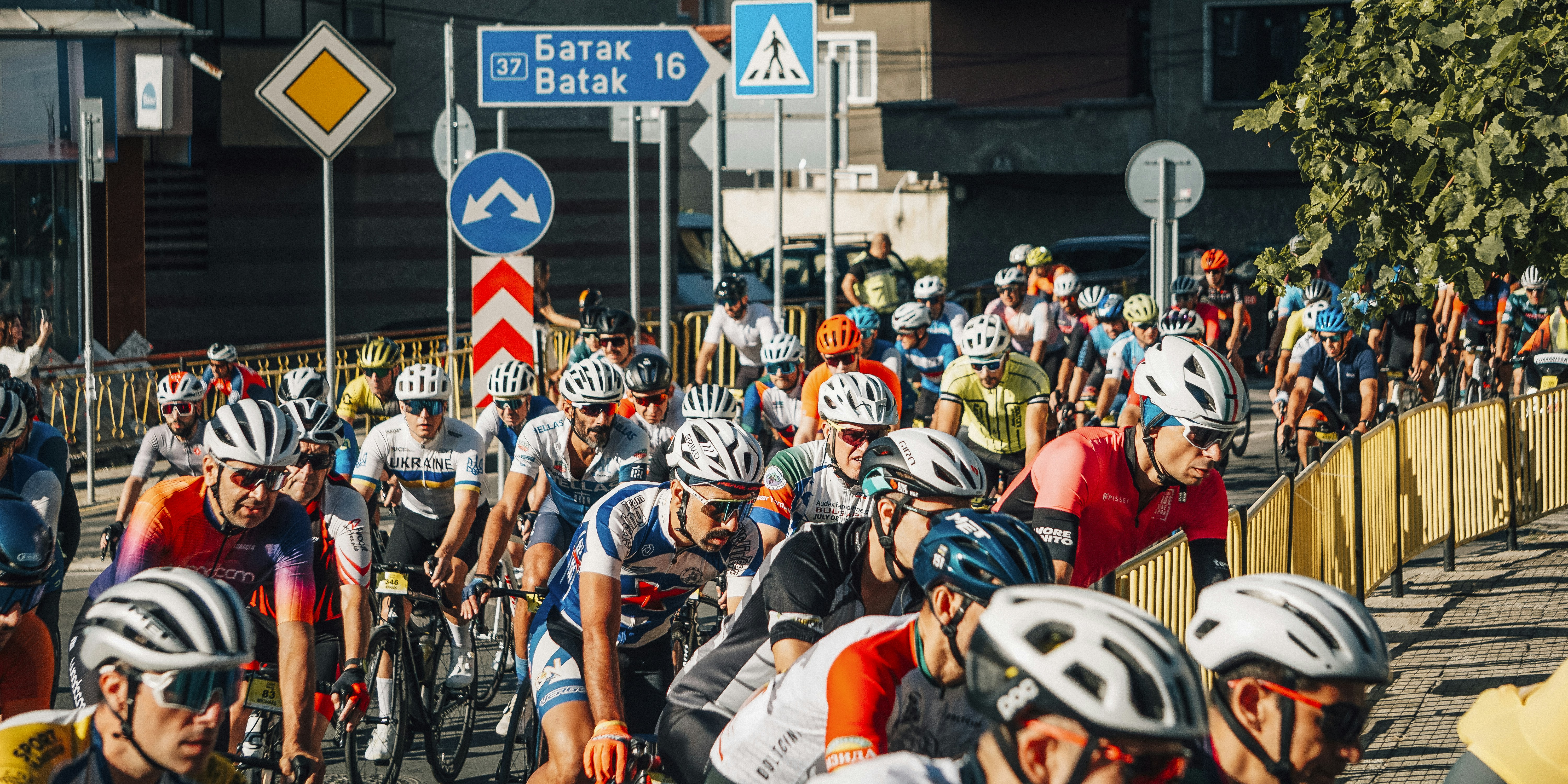 Urban Peloton at the Barricade: Helmets, Signs, and Motion