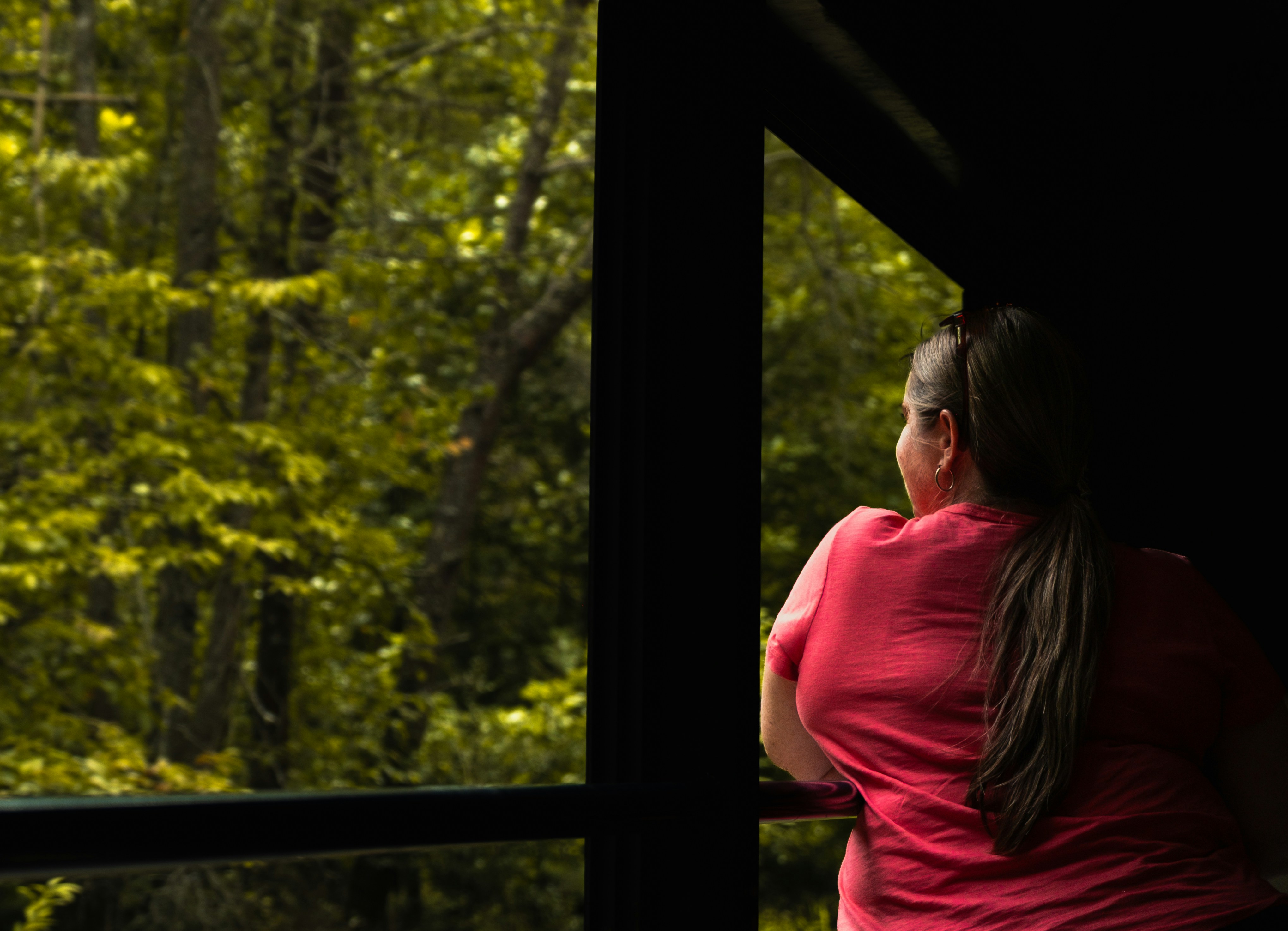 Red Shirt at the Threshold: A Quiet View from the Veranda