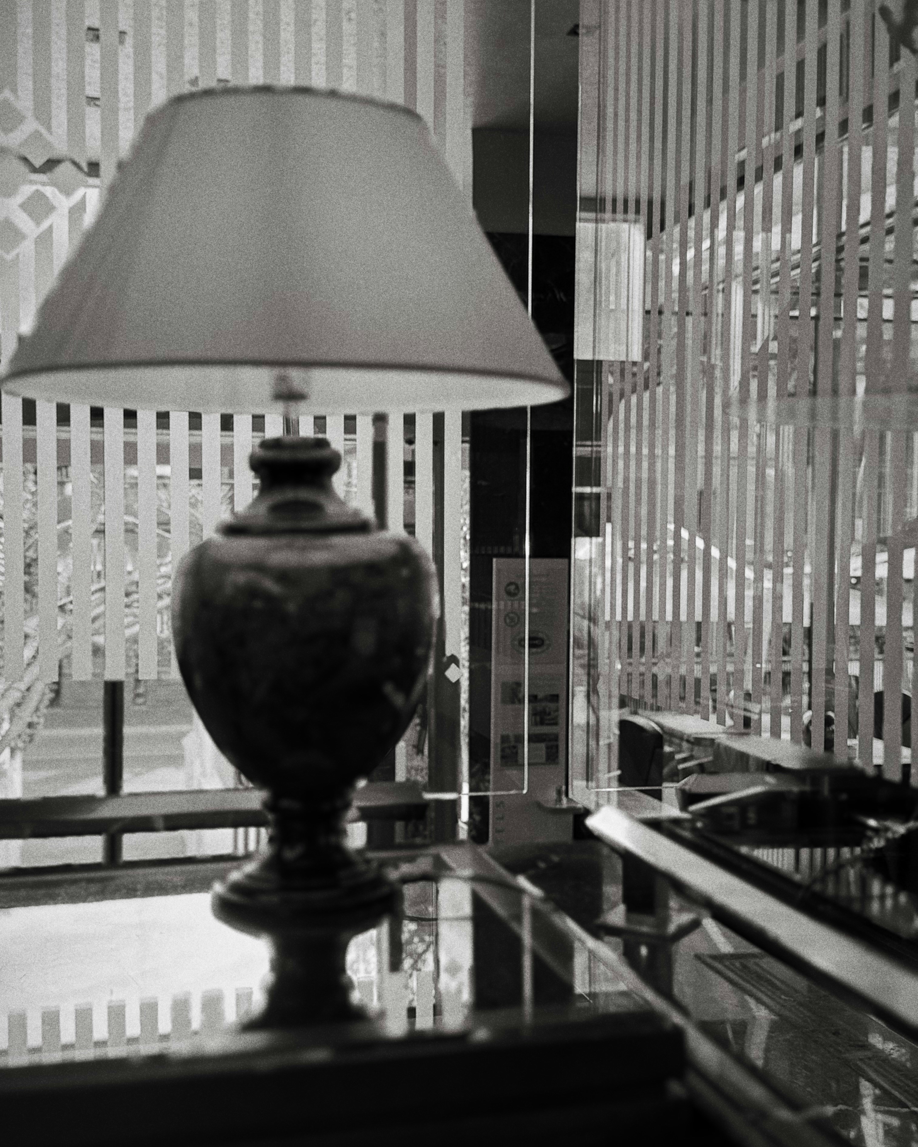 Lamp and Lattice: A Quiet Hotel Lobby in Monochrome