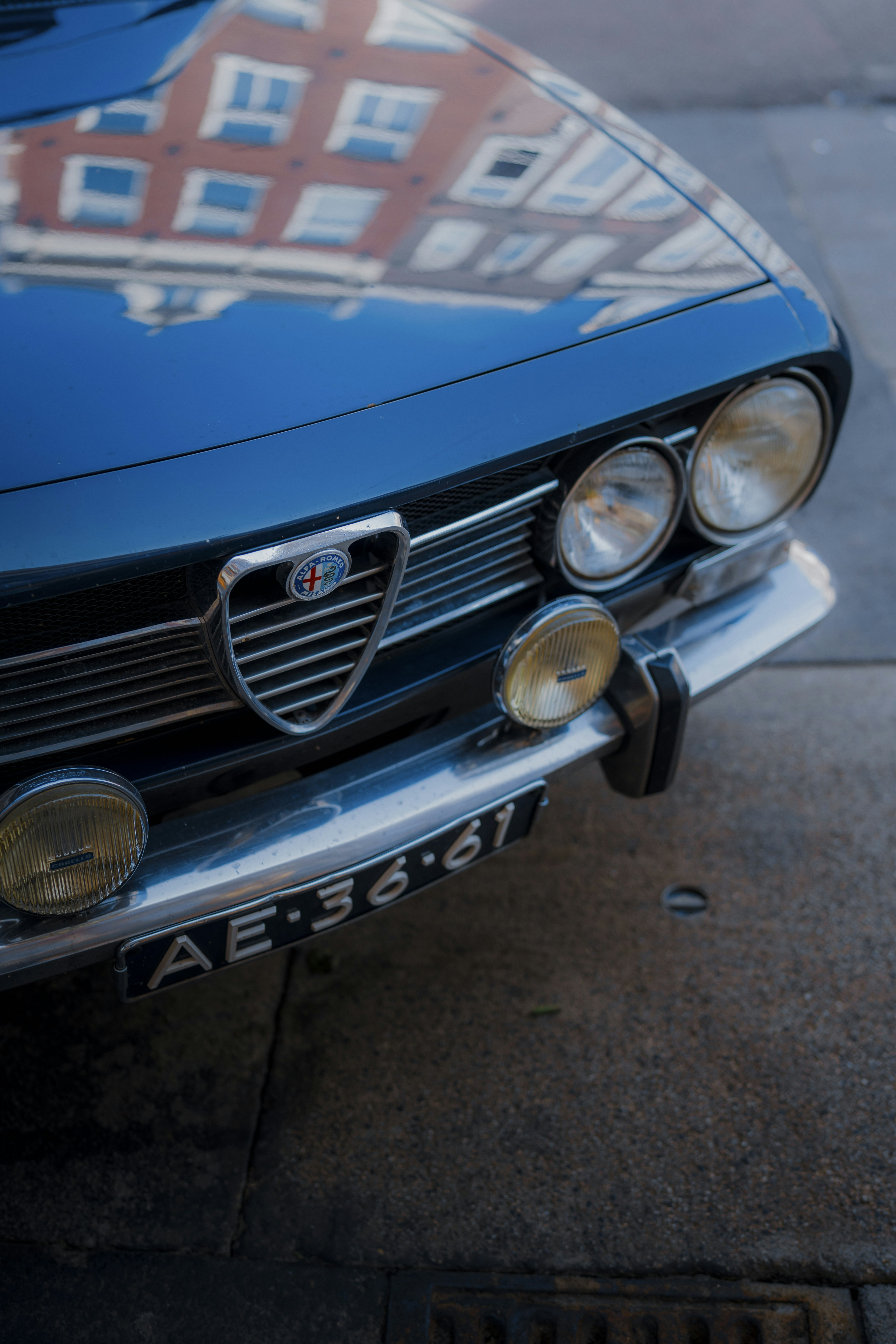 Close-up of a vintage blue car's front