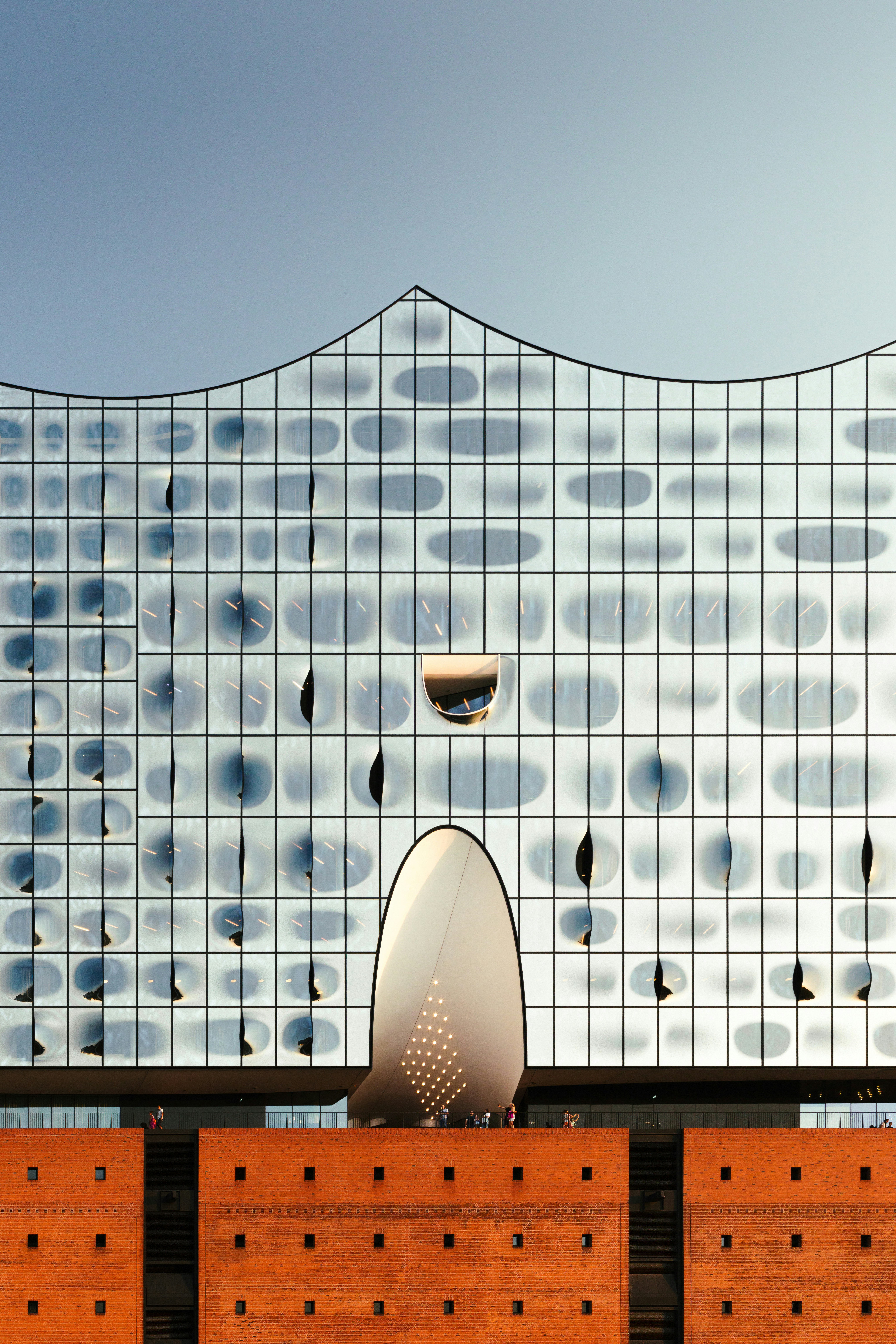 Elbphilharmonie, Hamburg | Modern glass building with brick base under clear blue sky