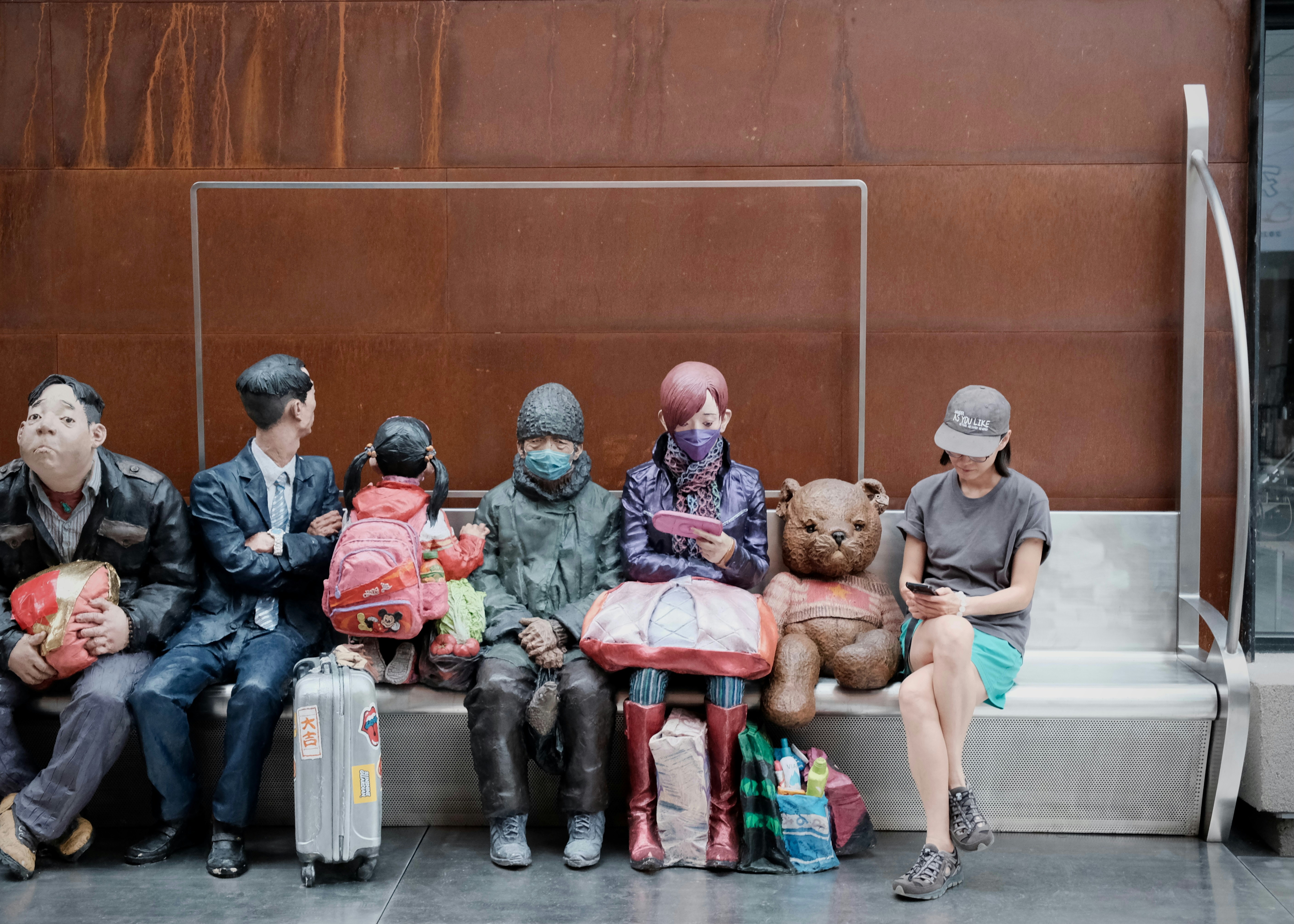 Waiting Line at the Platform: A Row of Passengers with Personal Gear