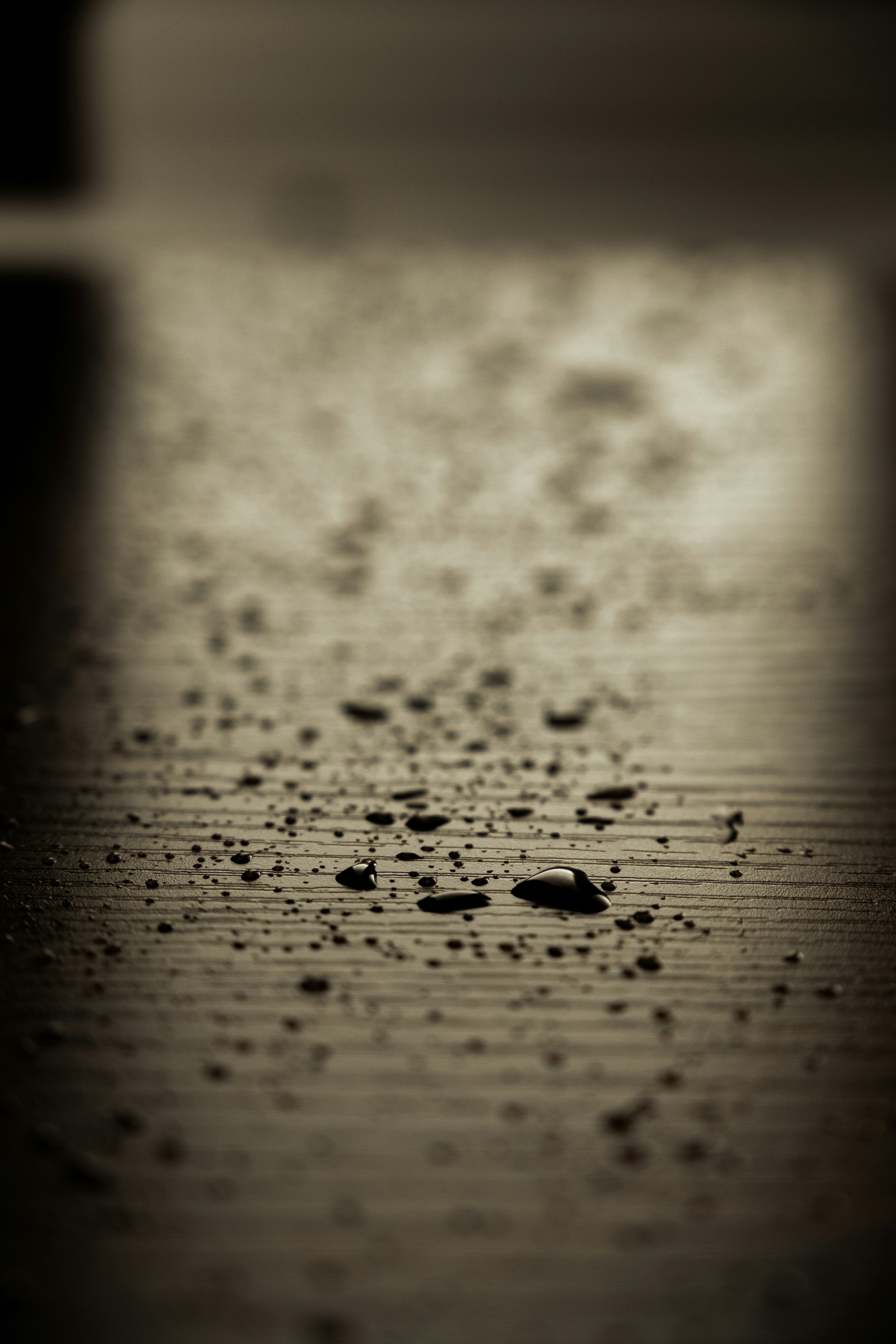 Loved capturing this moment 📸. If you enjoy minimal photography, check out my guide here: https://quietminimalism.etsy.com/listing/4347811015 | Water droplets scattered on a textured surface