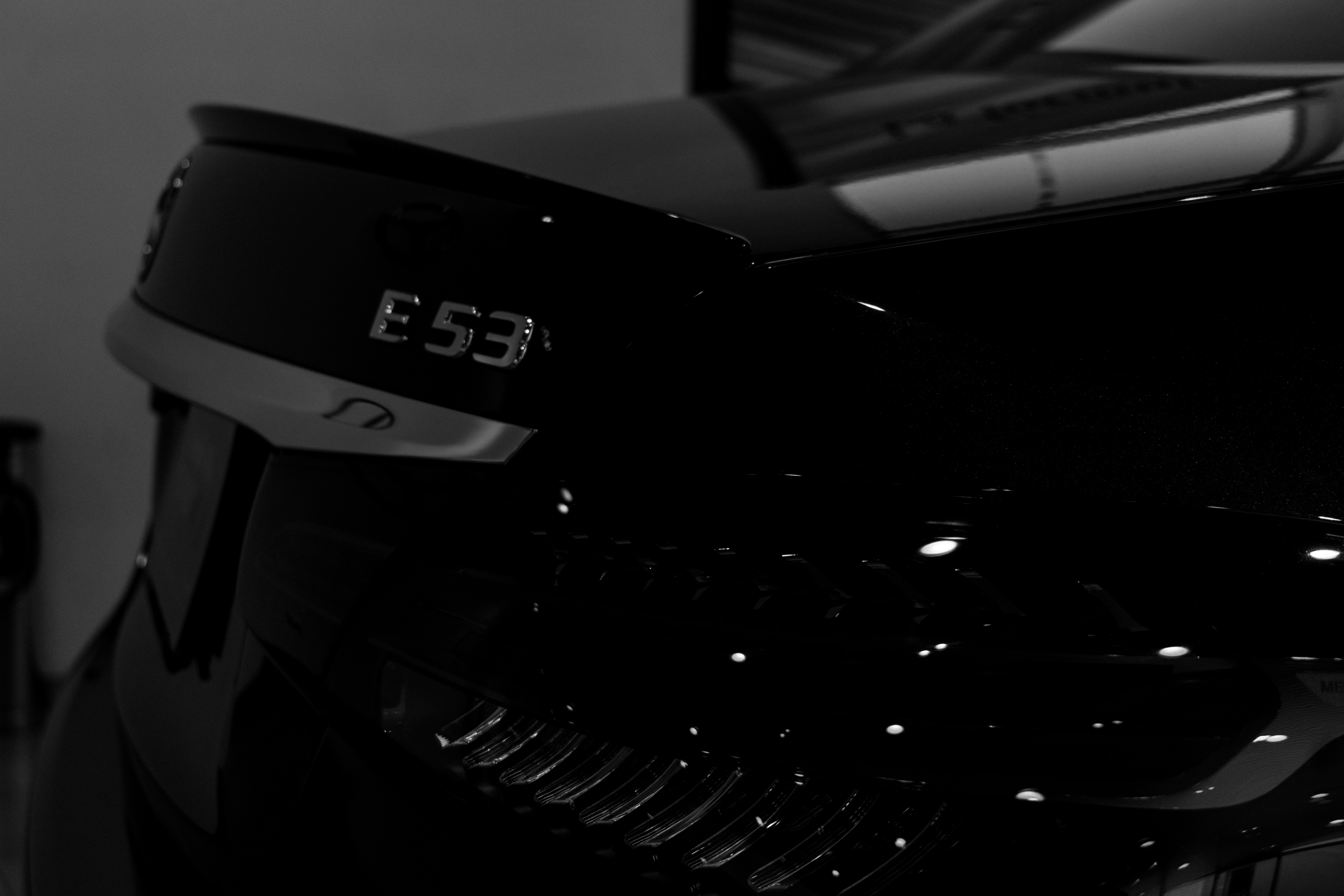 Black luxury car trunk with e53 emblem.