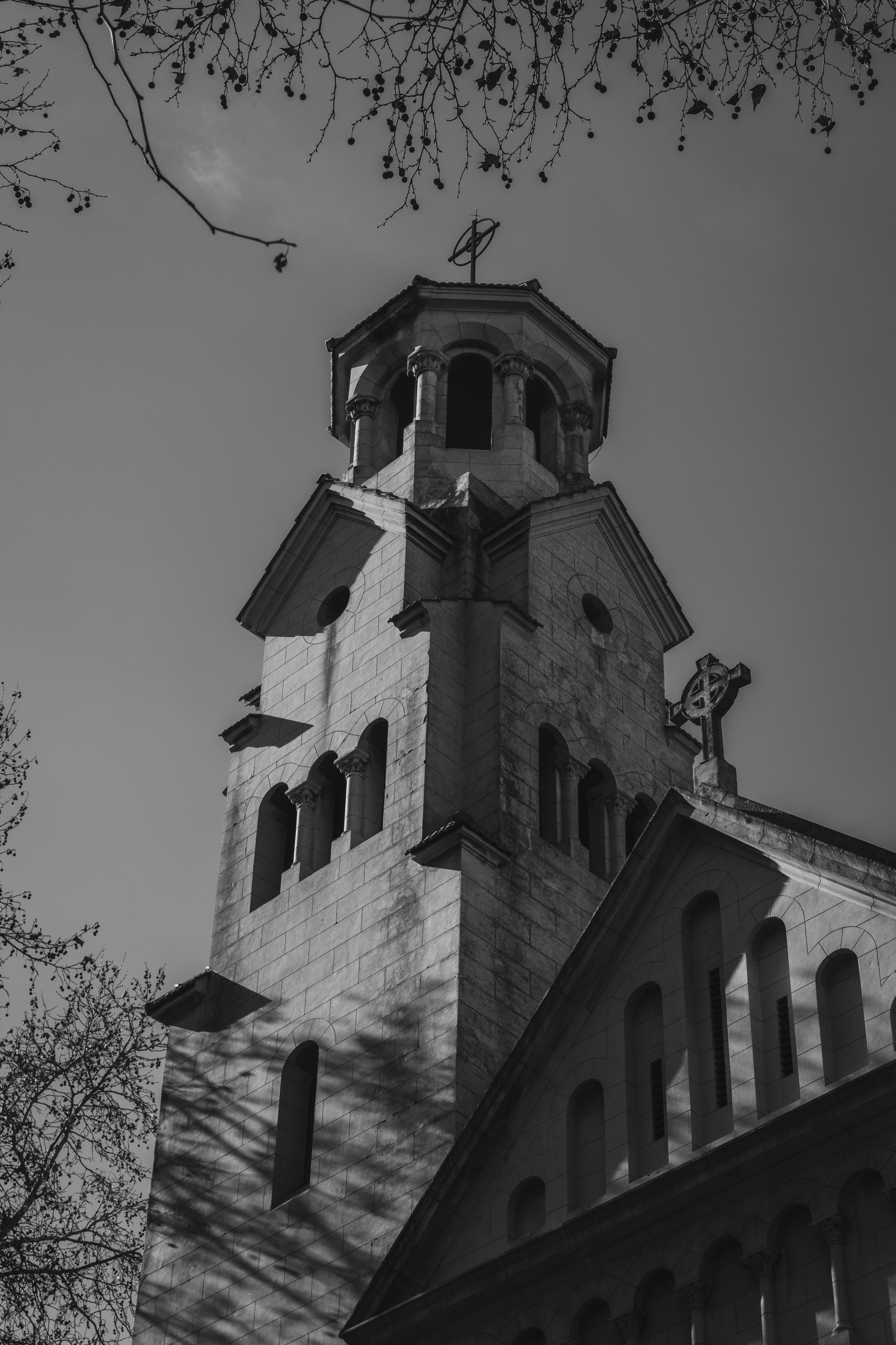 A black and white view of a church tower
