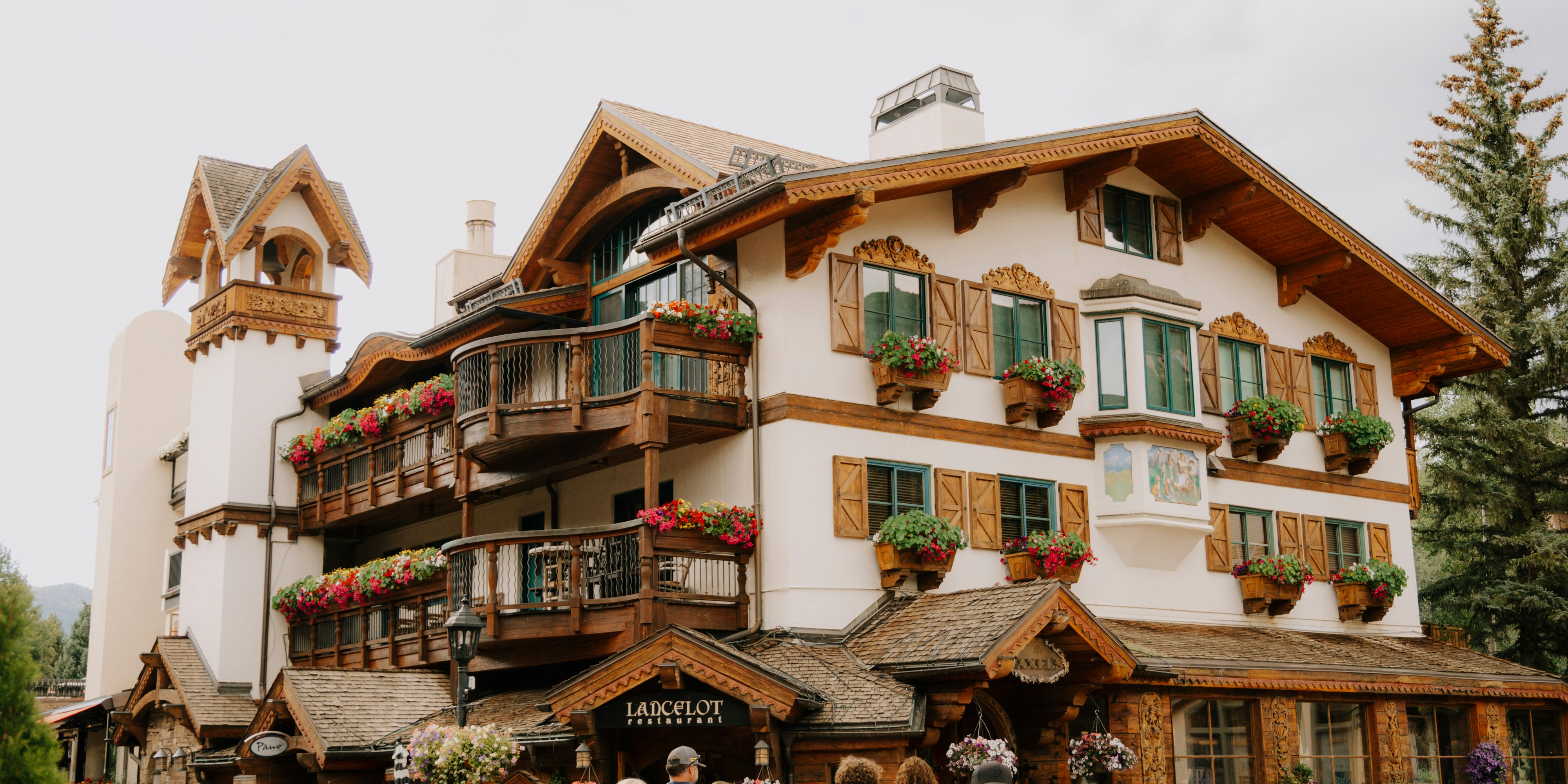 Chalet Chronicle: A Flowered Facade Rising Over Timbered Balconies