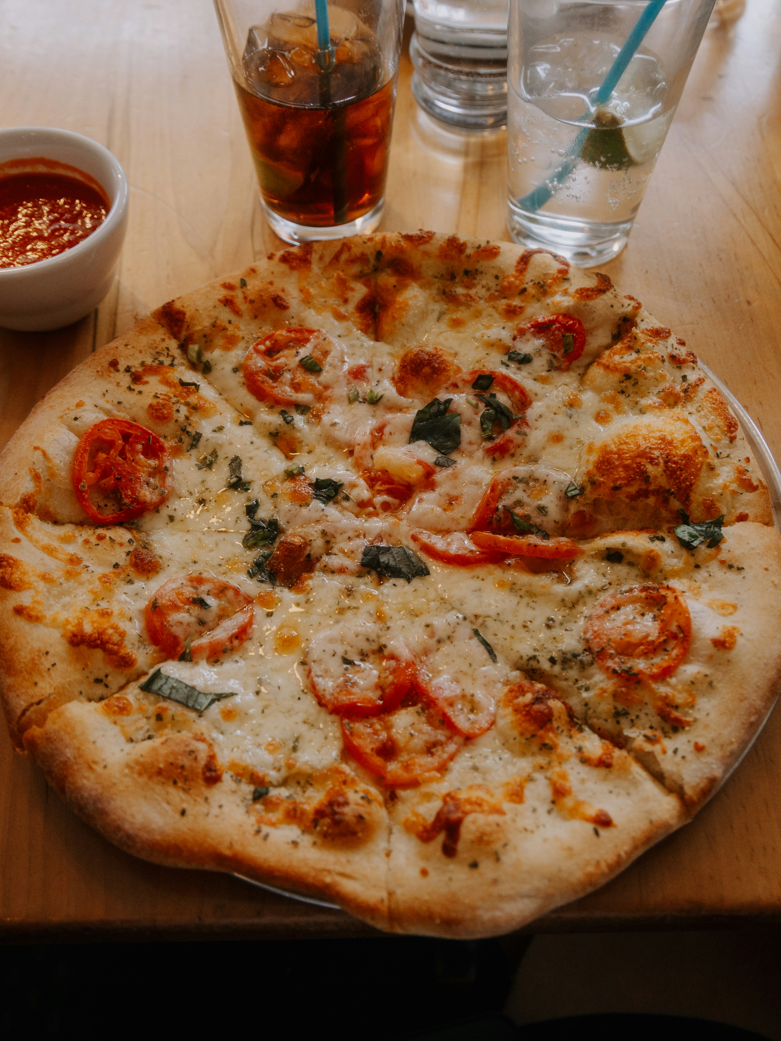 A delicious pizza with tomato and basil