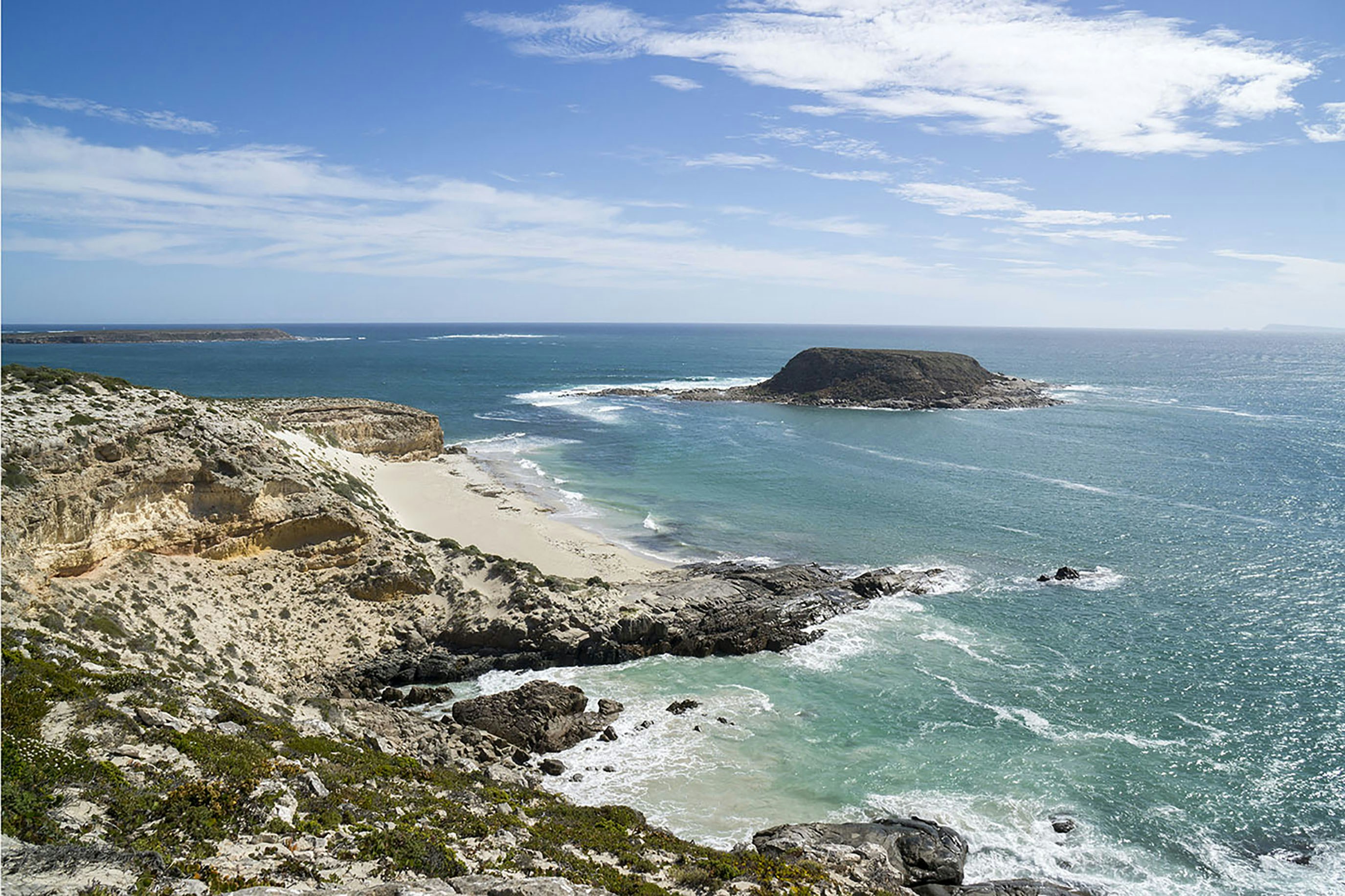 Rocky coastline with sandy beach and ocean waves photo – Free Sea Image ...
