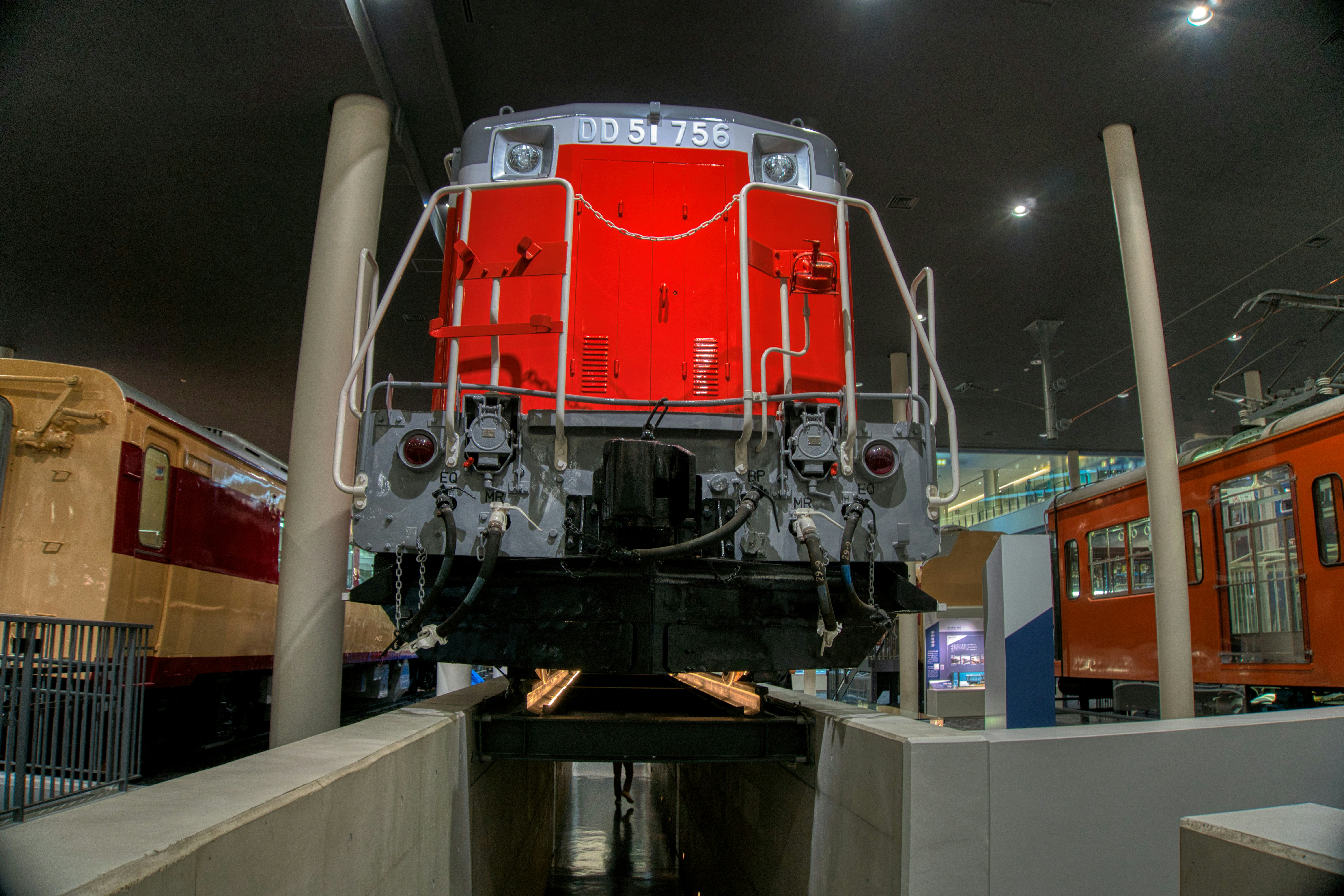 Red and silver train engine on display