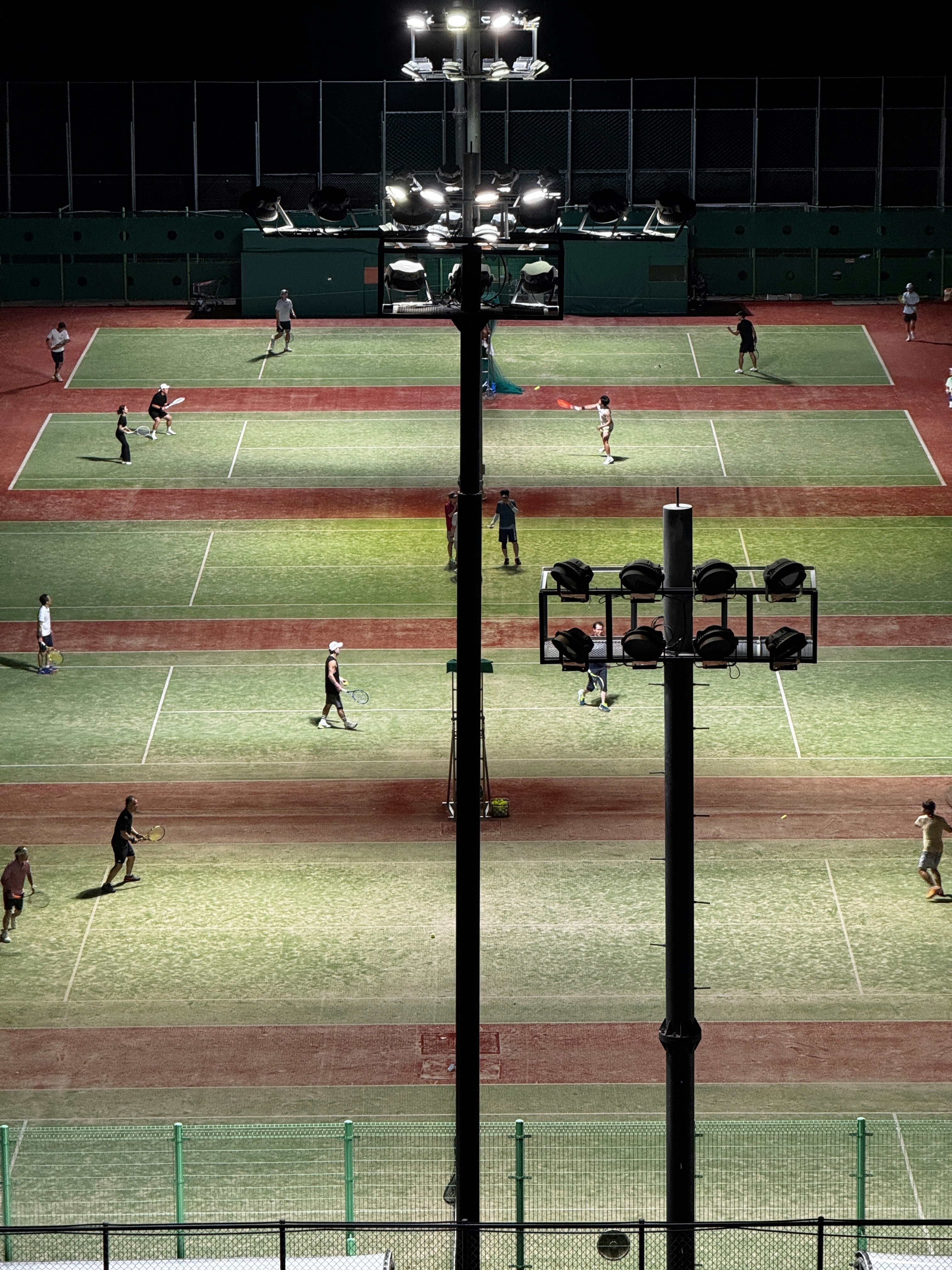 Tennis court in Seoul Korea | People playing tennis on illuminated courts at night