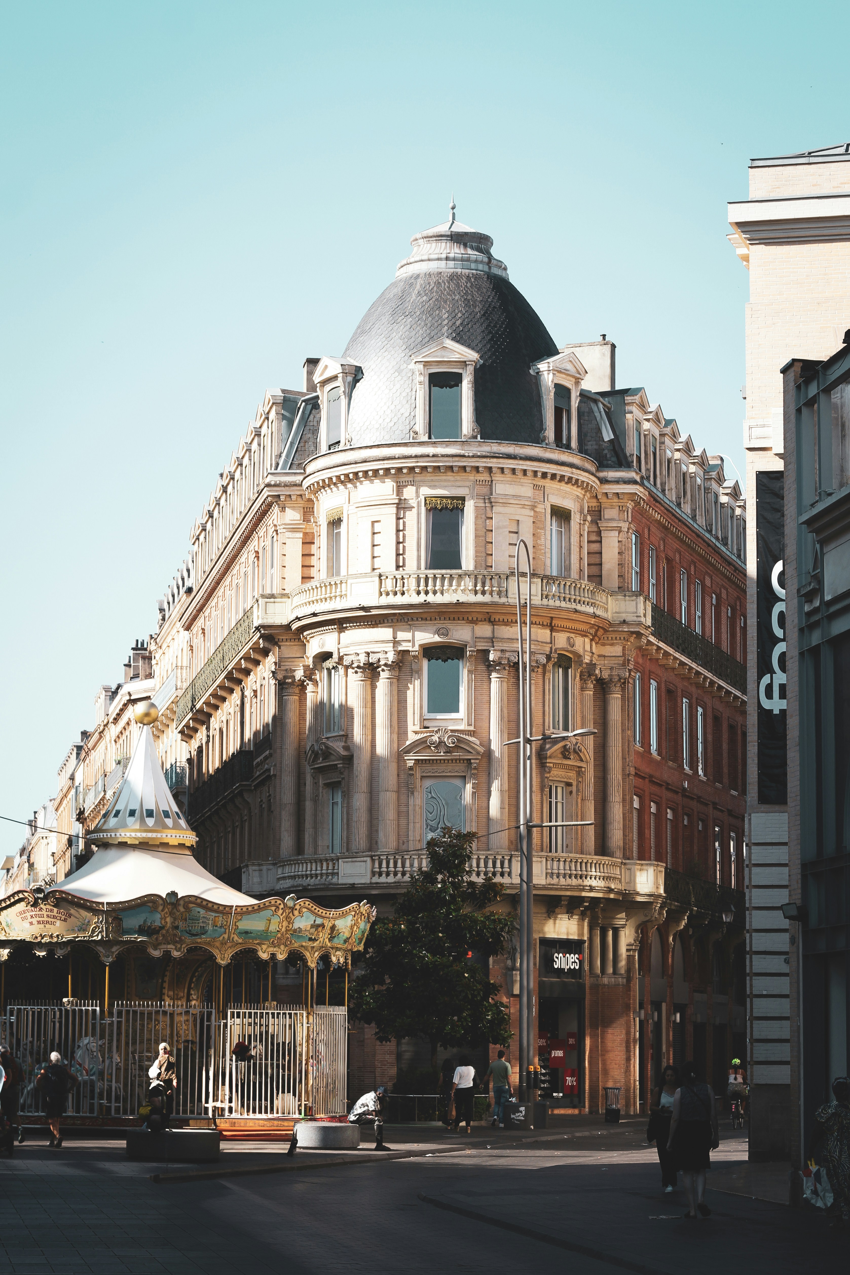 Ornate building with a carousel on a sunny day