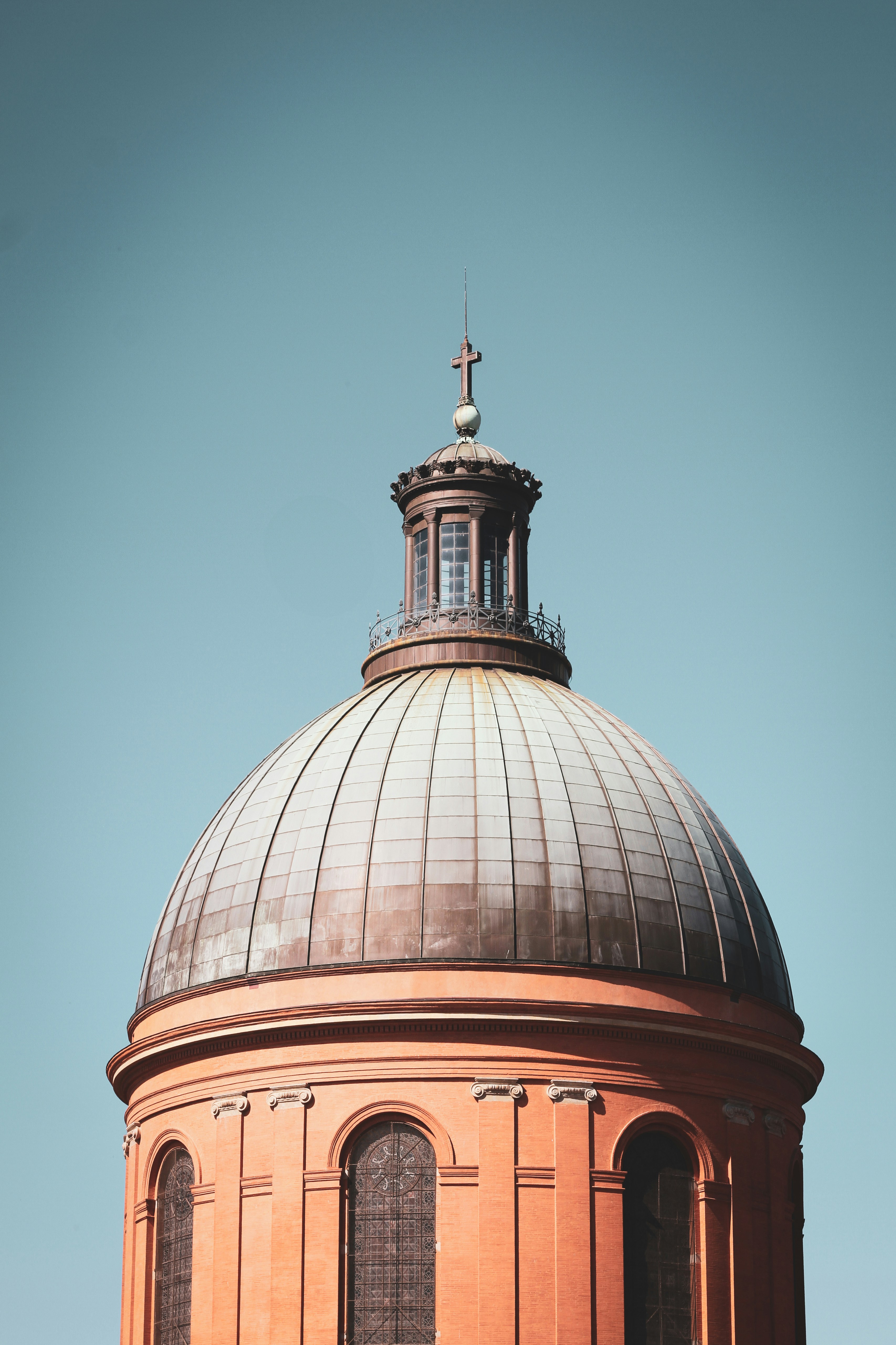 Close-up of a domed building with a cross